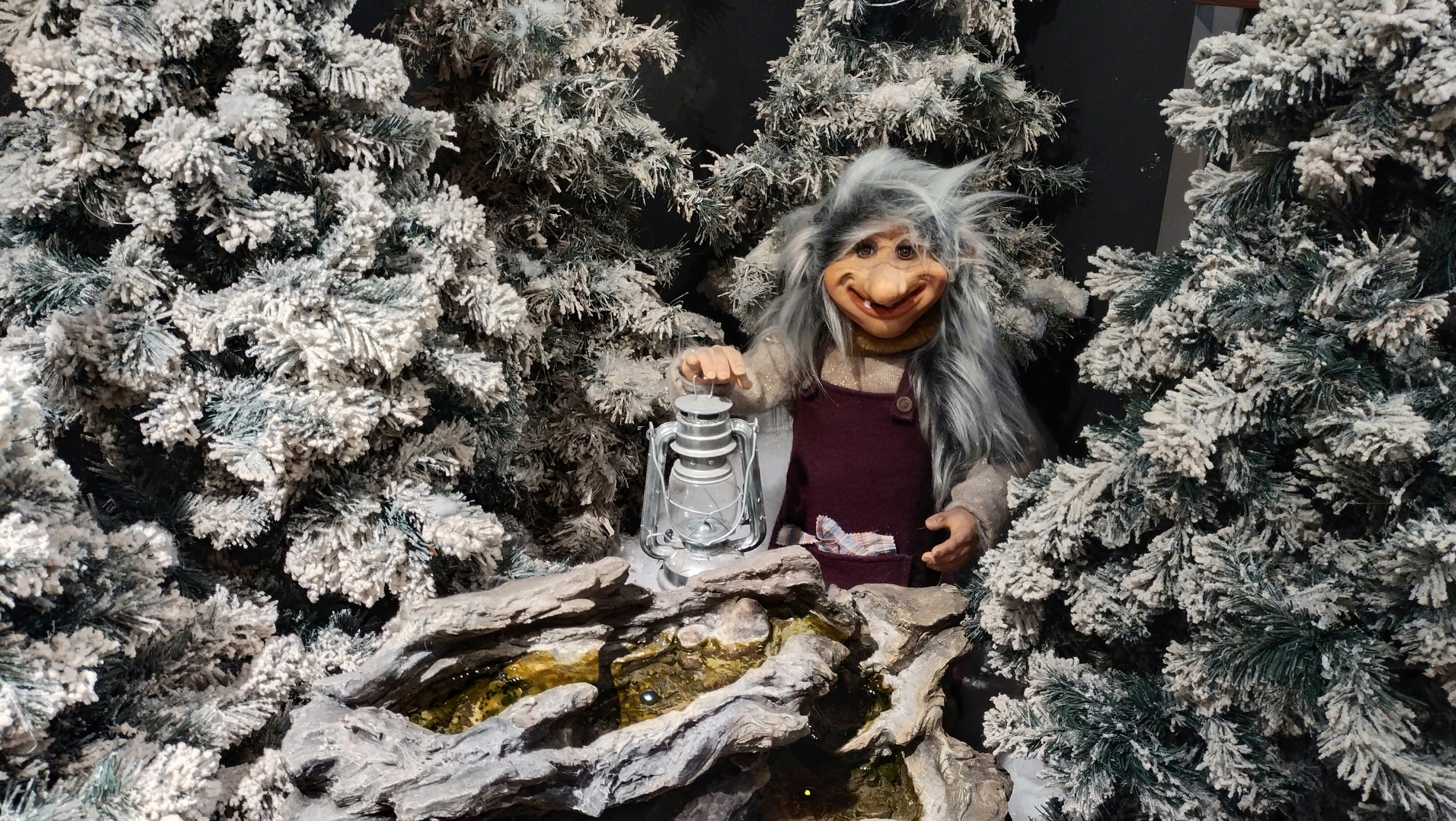 Snowy Workshop with a Grinning Troll