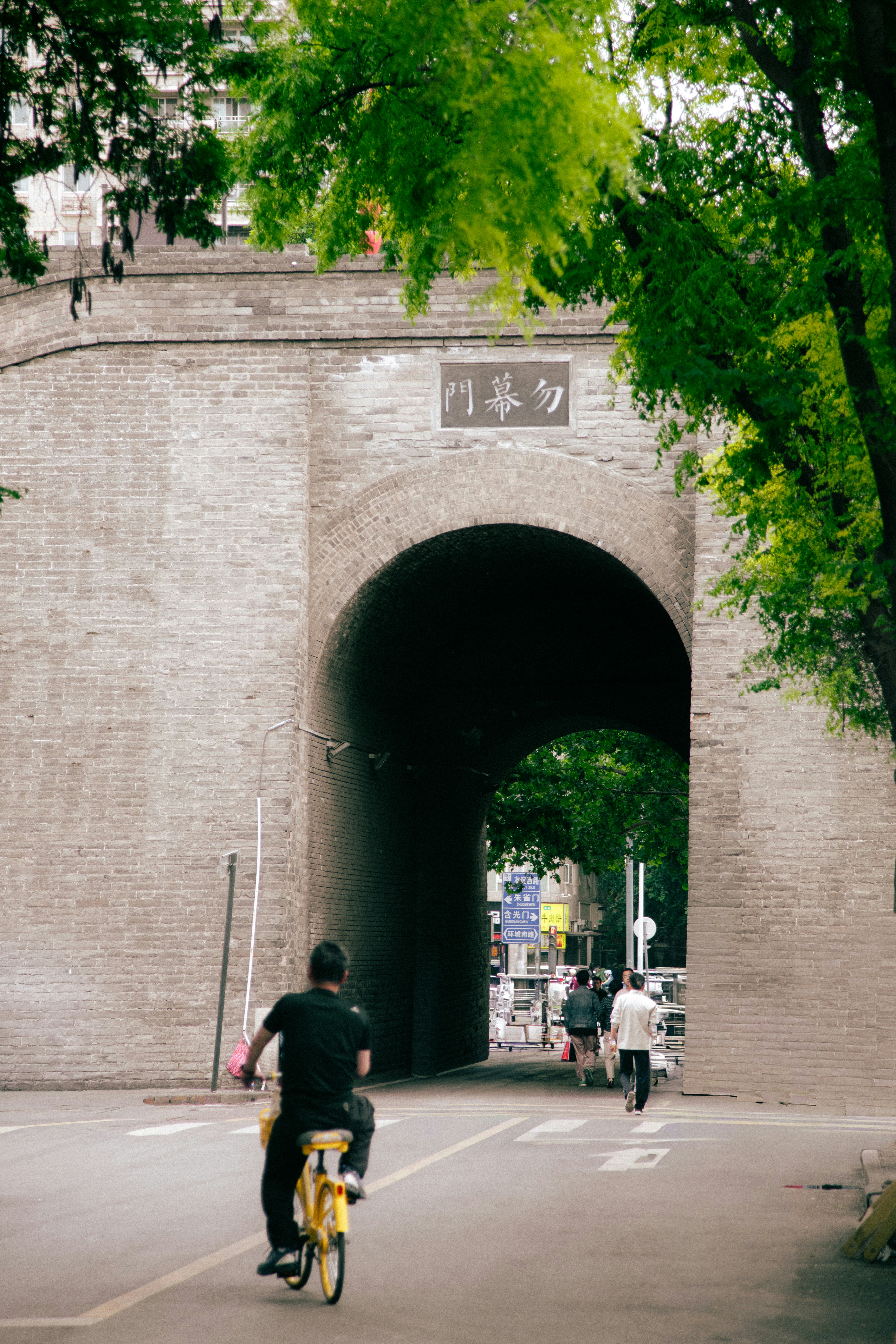 Through the Gate: A Quiet Street Passes Beneath an Ancient Arch