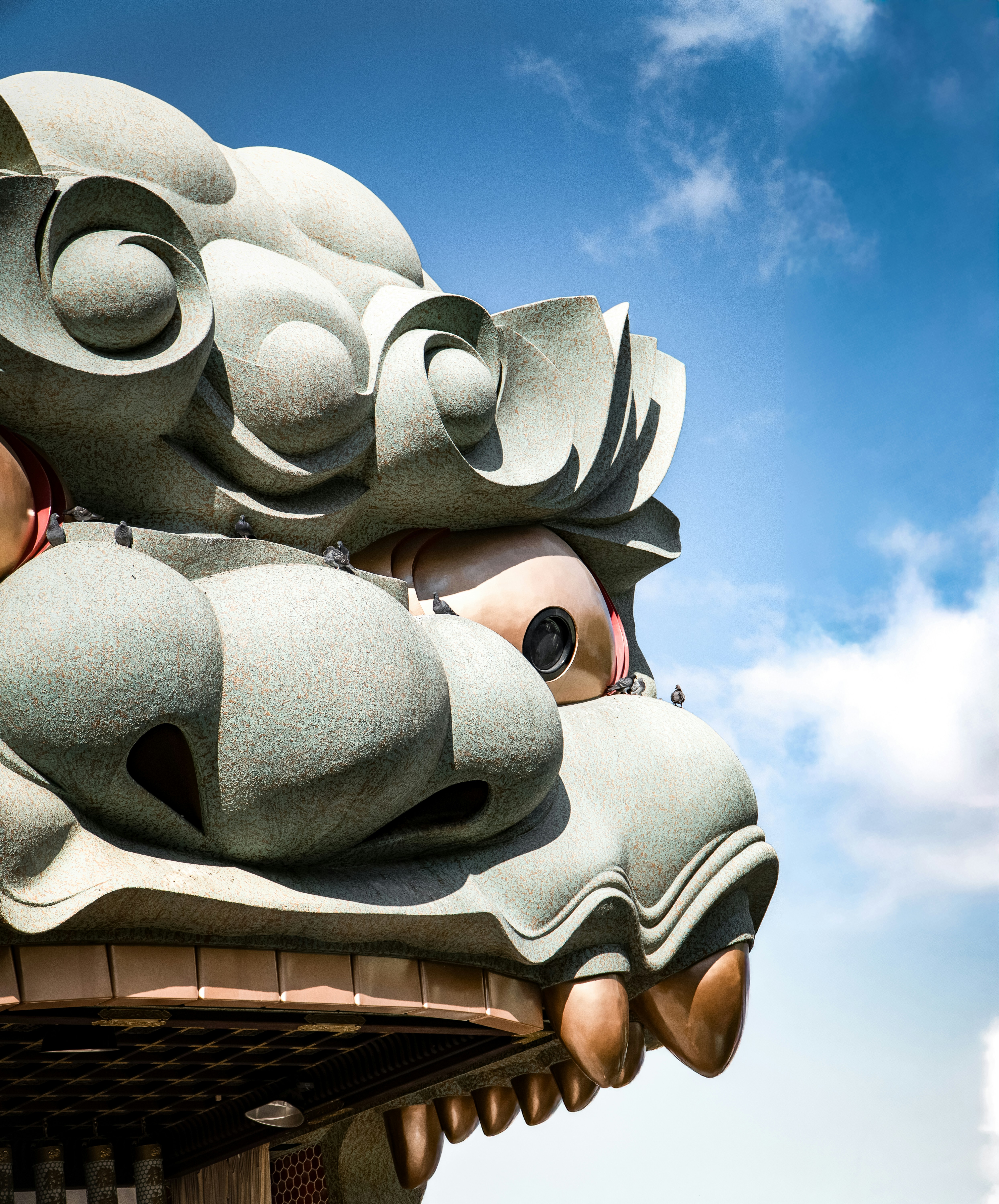 Dragon's Gaze: A Monumental Stone Carving Against a Clear Sky
