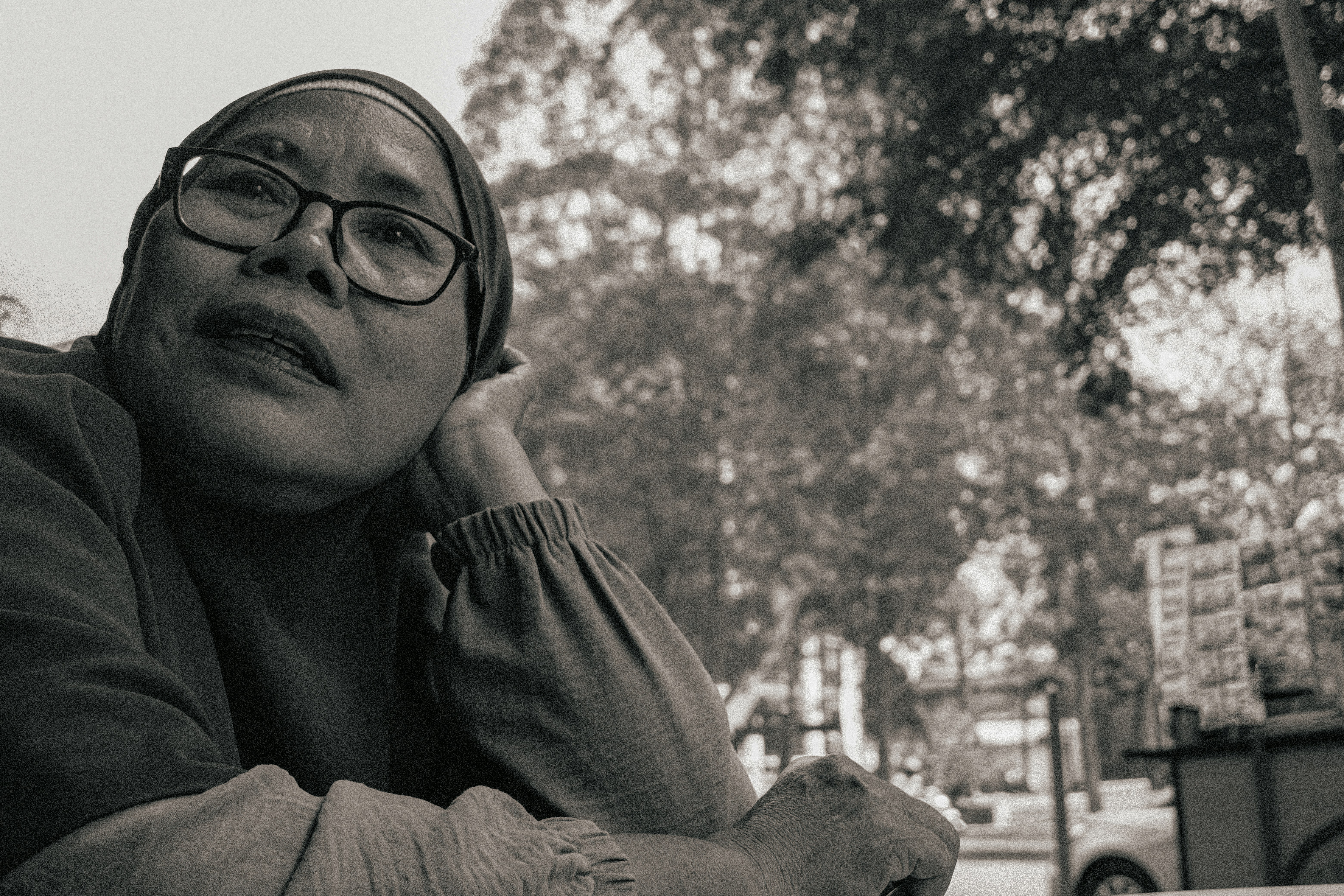 Contemplative Moment: A Quiet Portrait at the Park Edge