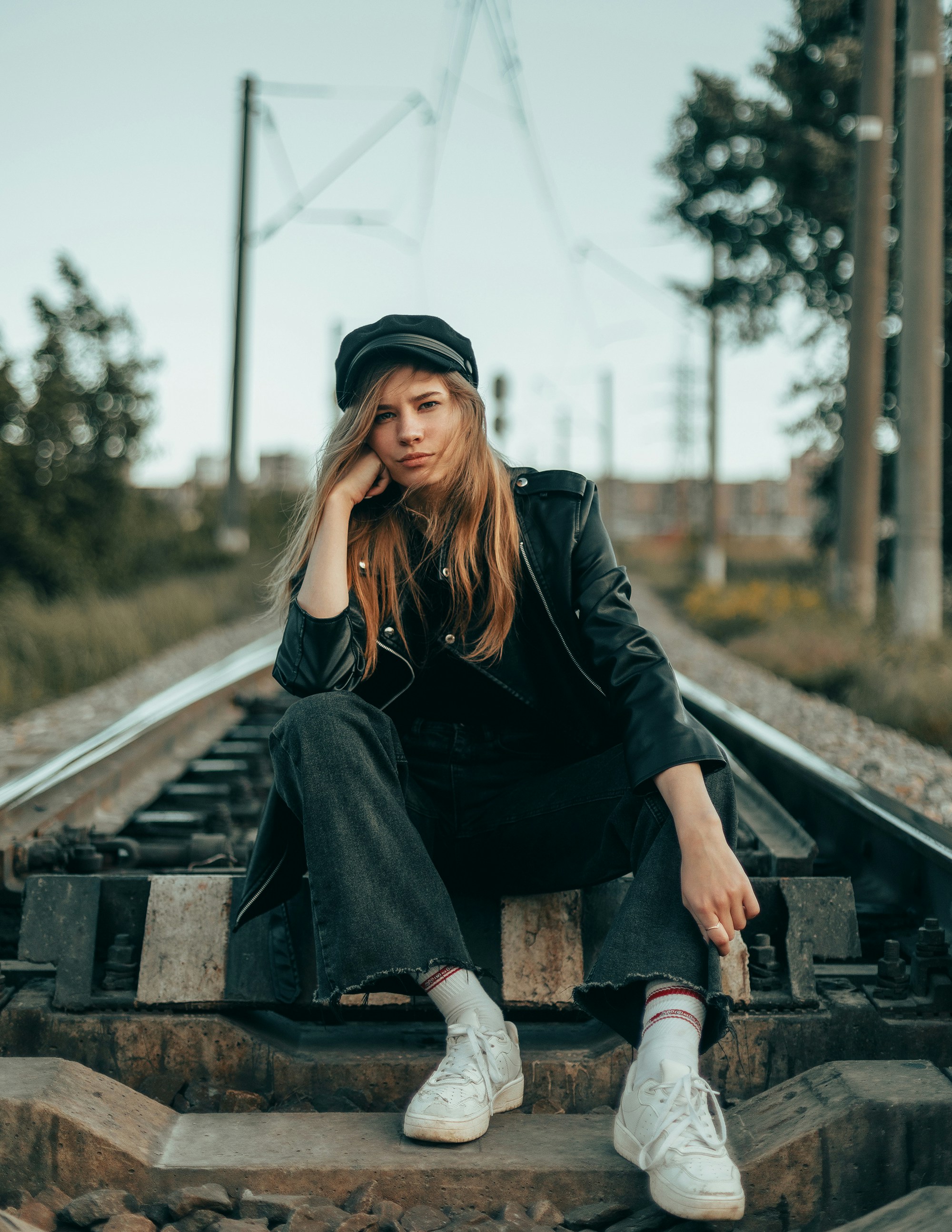 Railway Confidante: A Quiet Pose on the Rails