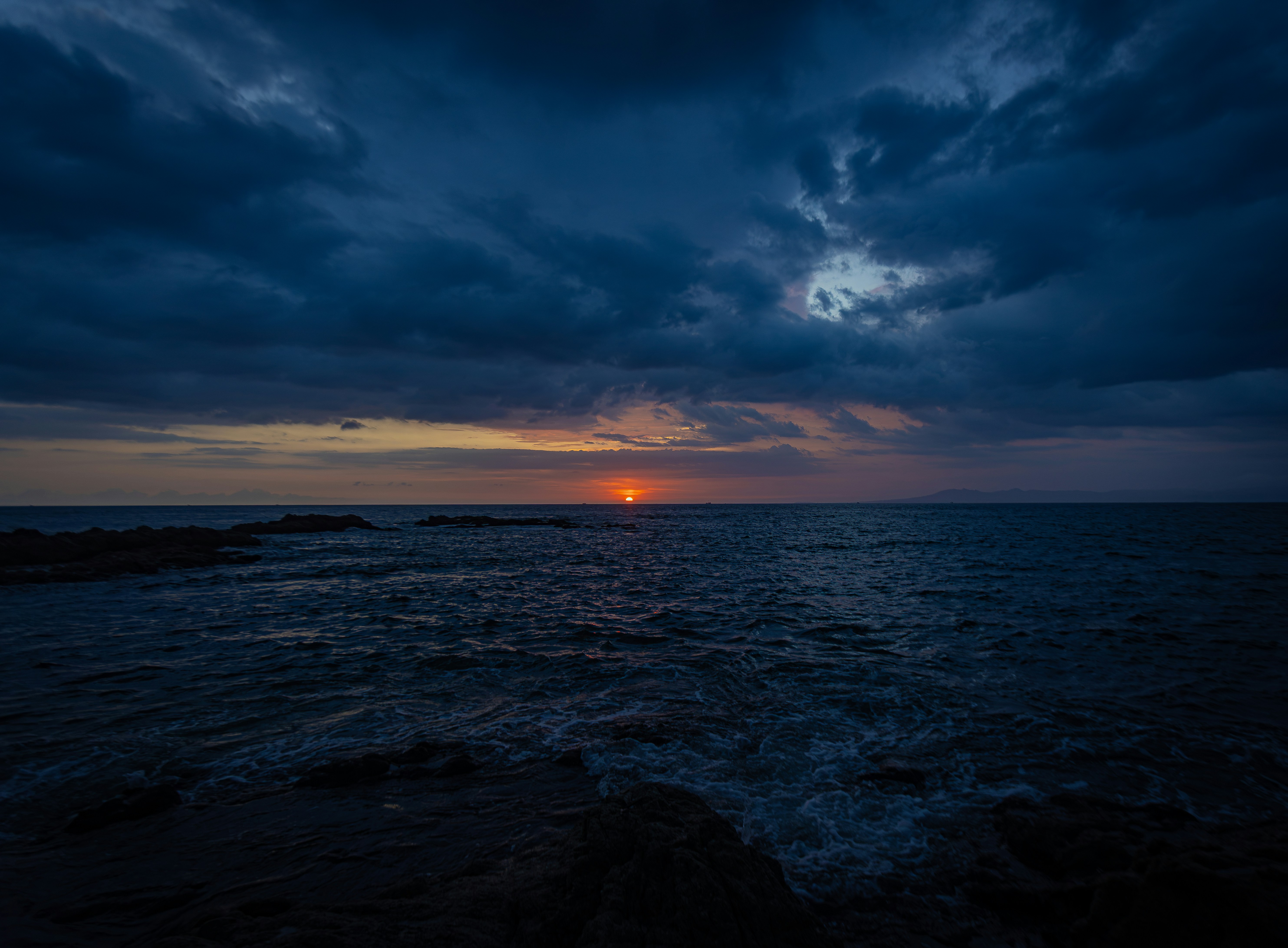 Distant Sunset on a Quiet Seascape