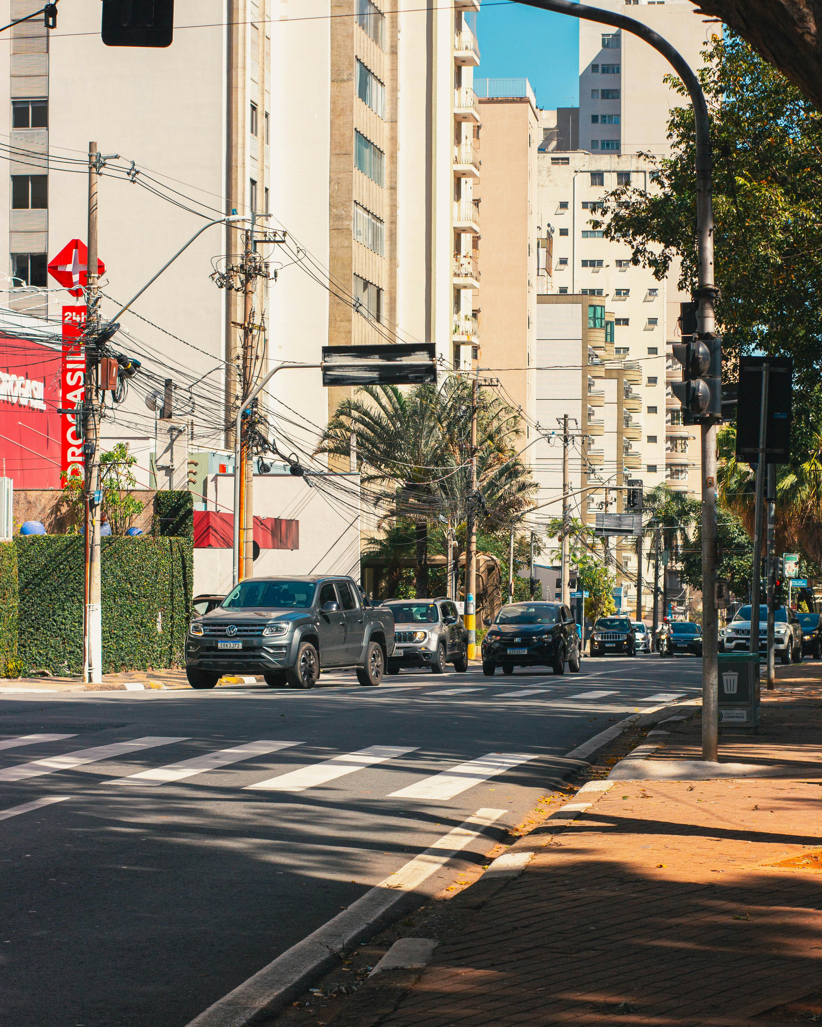 City Street in Motion: Cars, Crosswalks, and Vertical Urban Lines