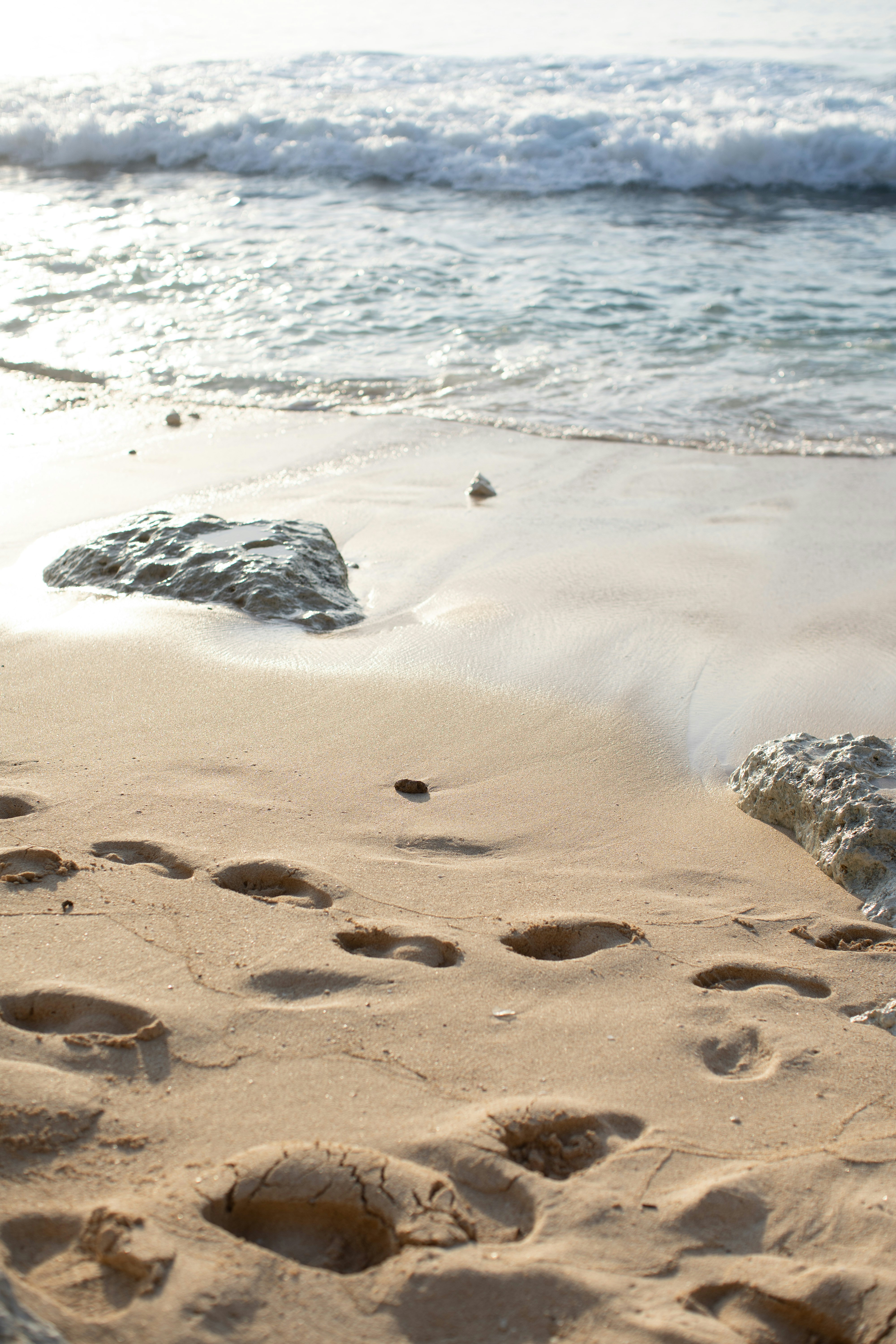 Footprints of Quiet Tide: A Sand Beach Stretches Toward the Sea
