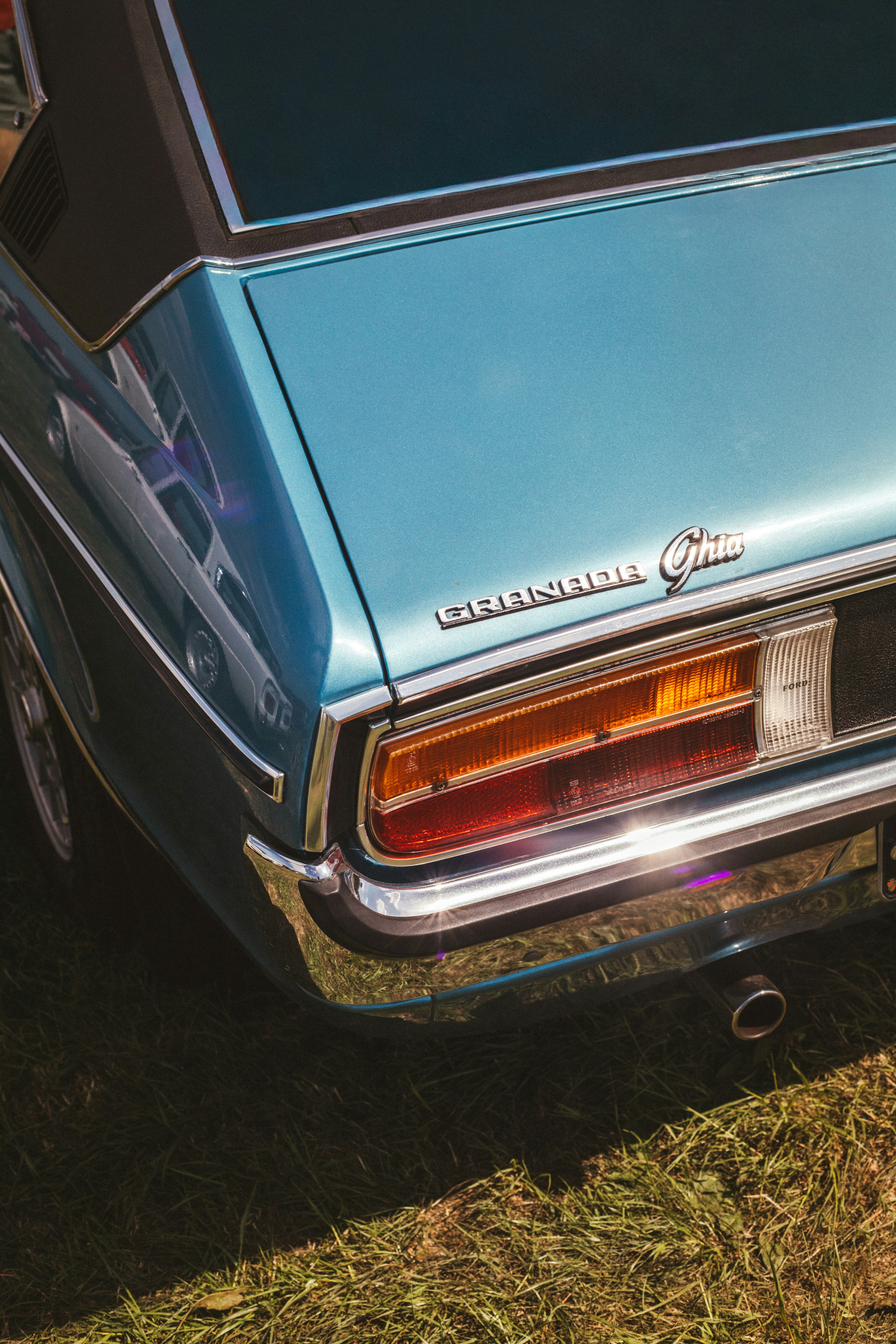 Blue Classic: Tail Lights and Emblem in Focus