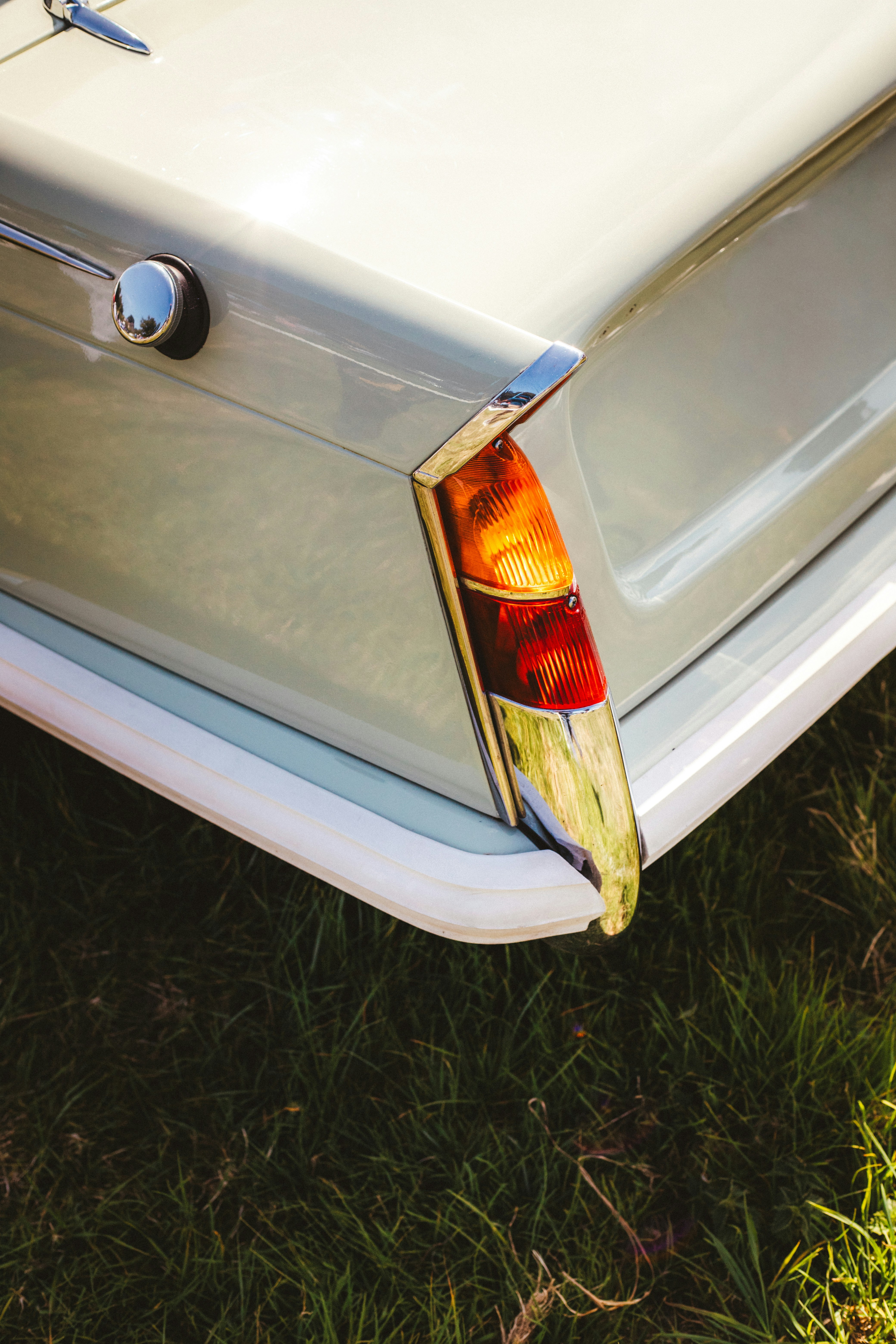 Sunlit Tailfin: The Quiet Rust of a Vintage Car