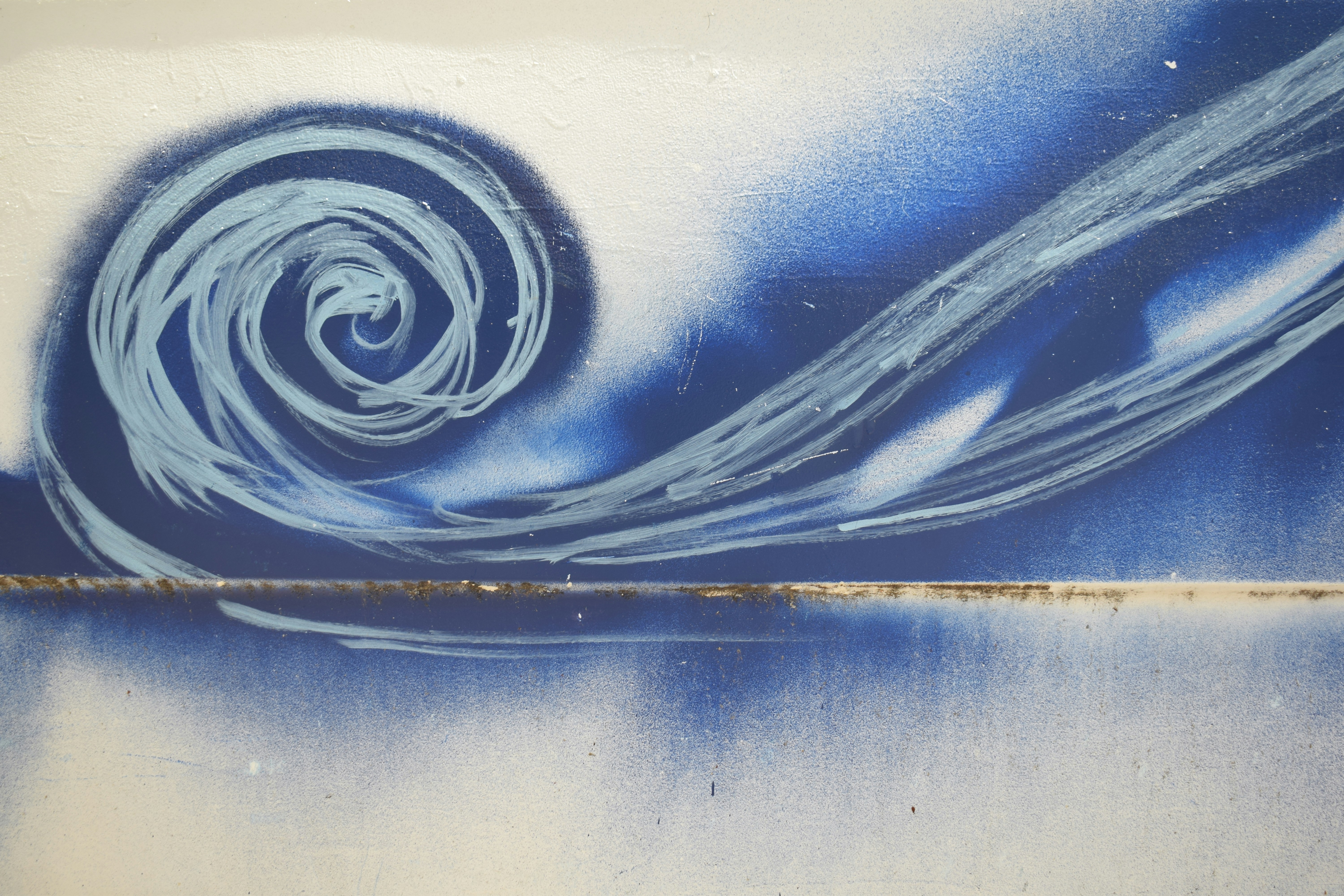 Swirl of Ink on Weathered Metal