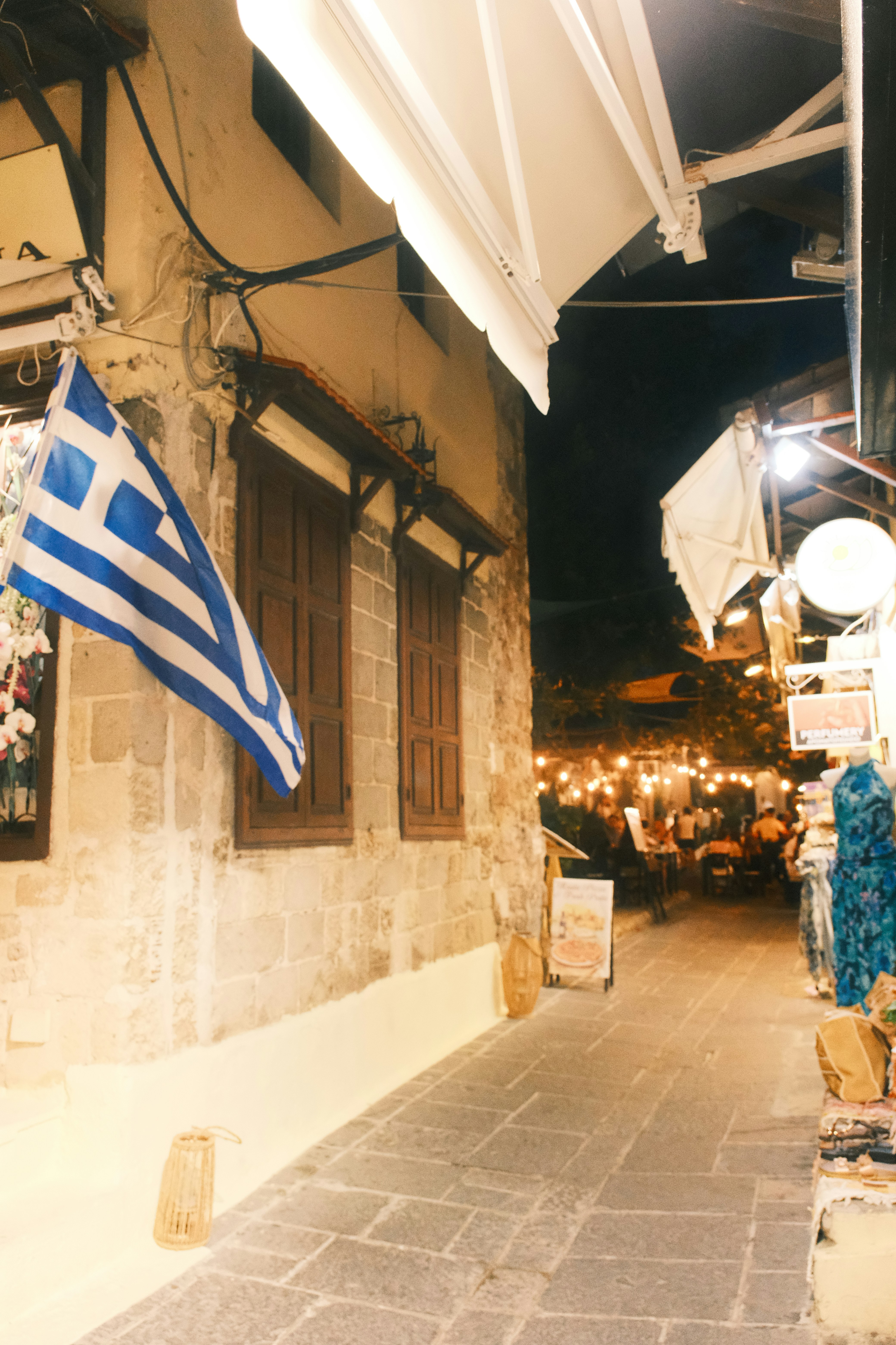 Greek Flag in a Moonlit Cycladic Lane