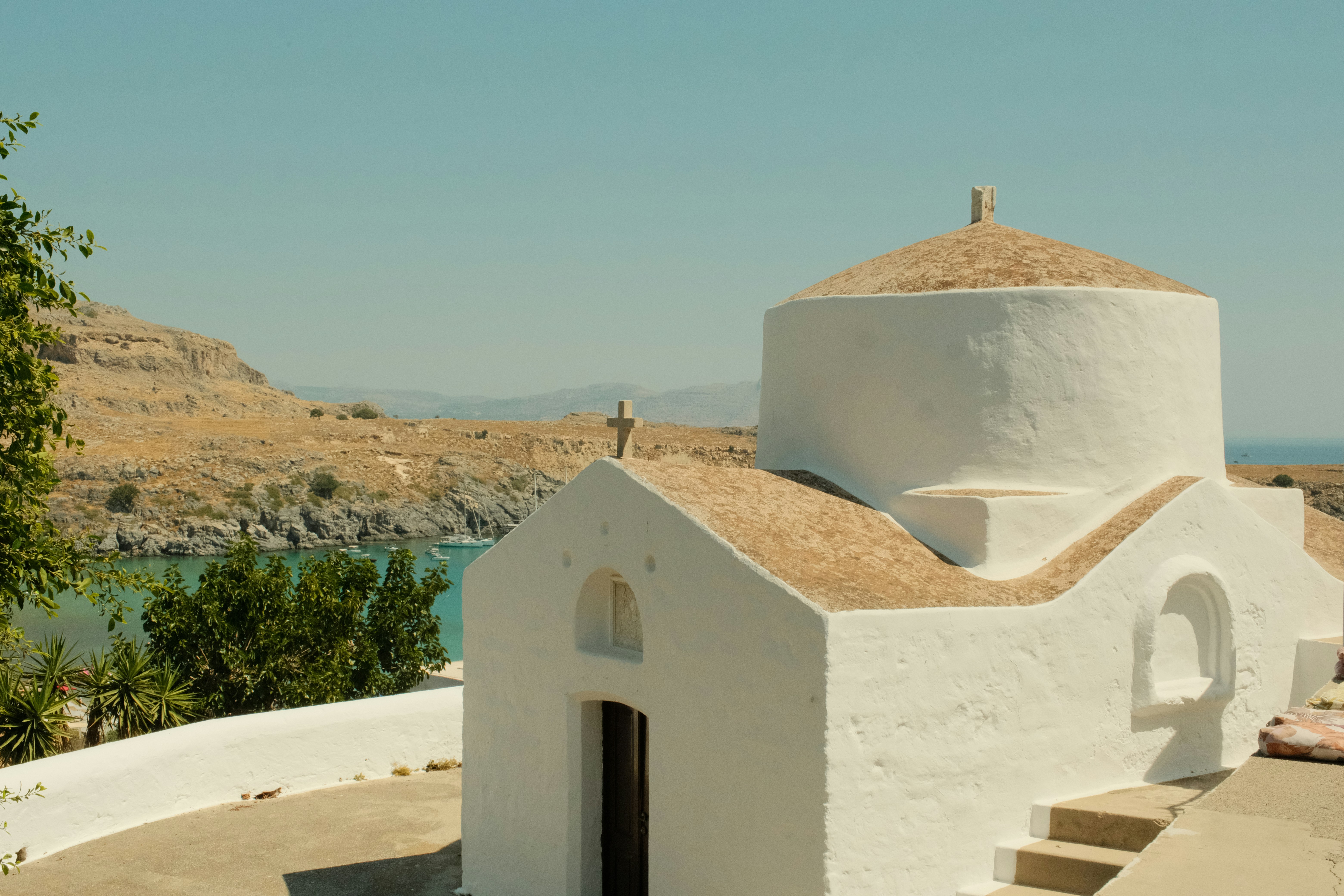 Sunlit White Chapel on the Coastline