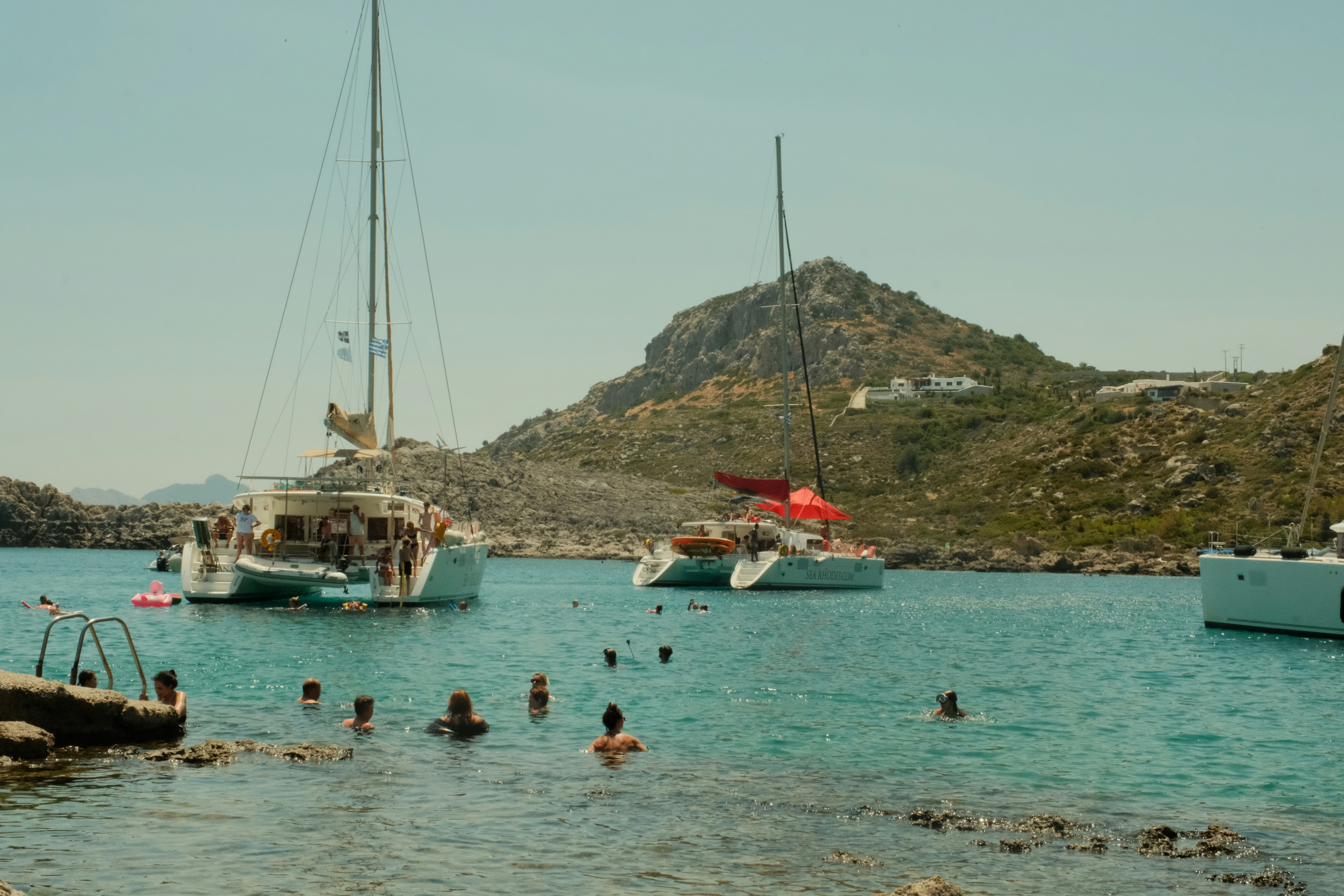 Harbor Swim: Boats at Rest and Sail in a Quiet Cove