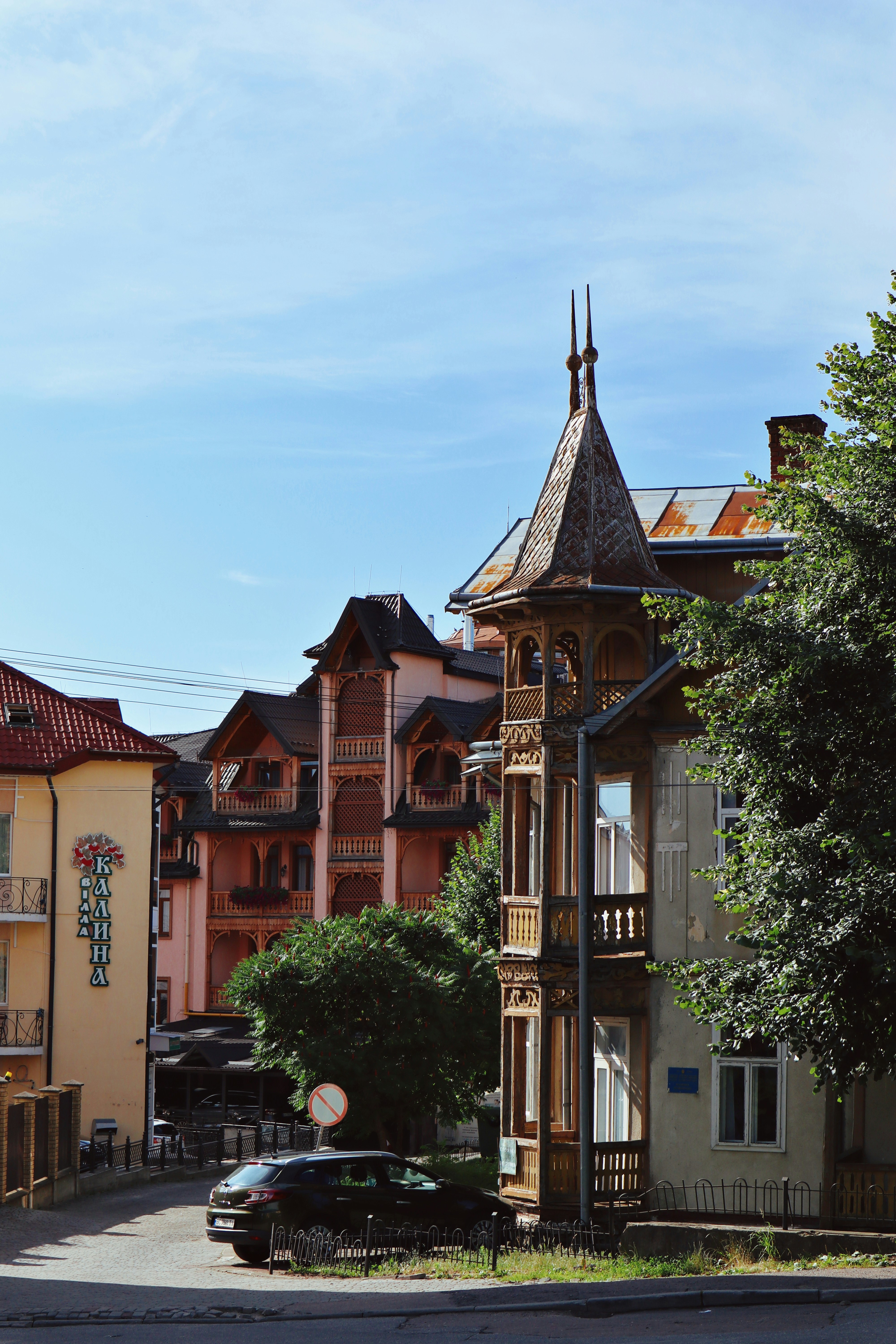 Architectural Bouquet: A Street of Timbers and Towers Under a Bright Blue Sky