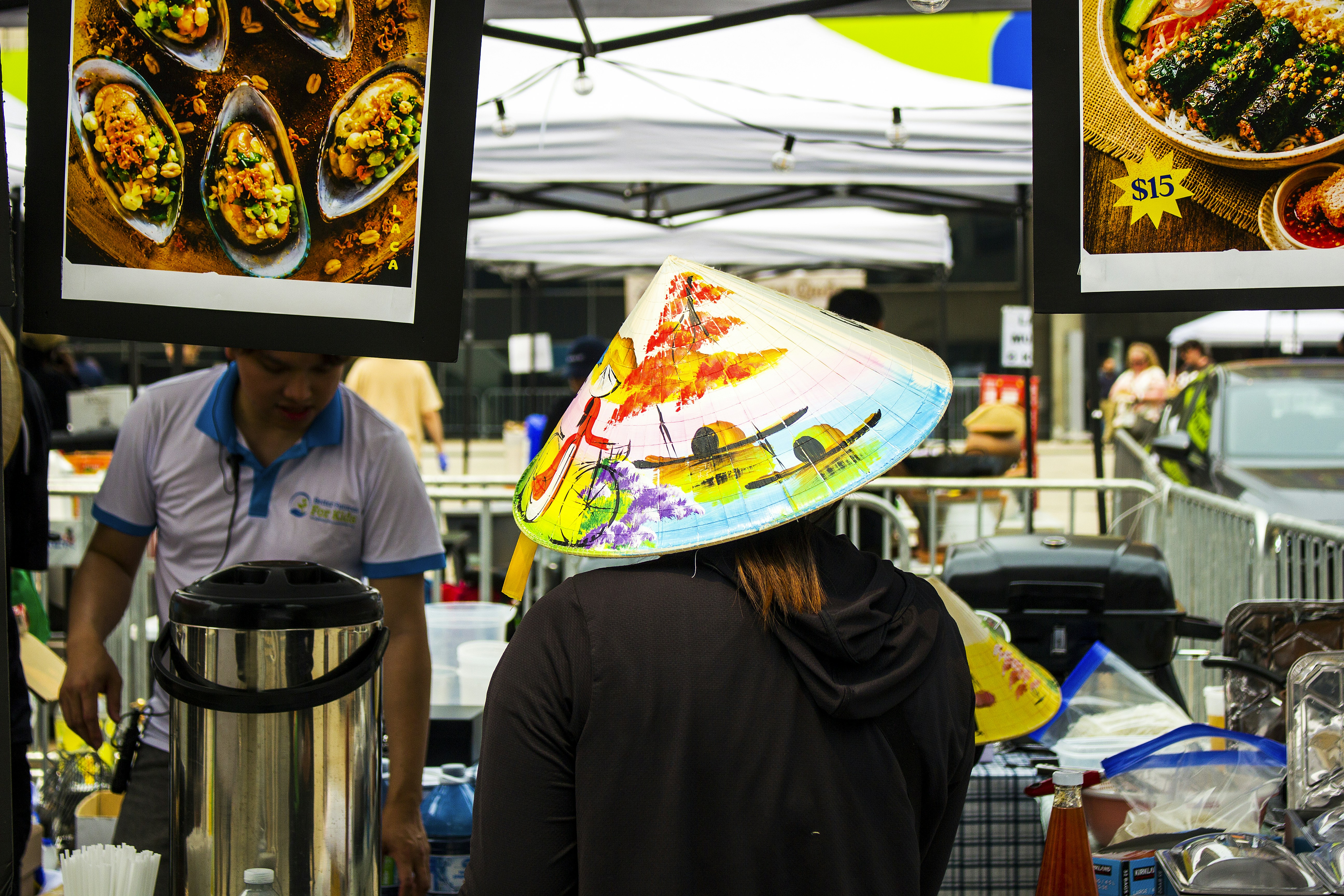 Colorful Cone Hat at a Busy Market Food Stall