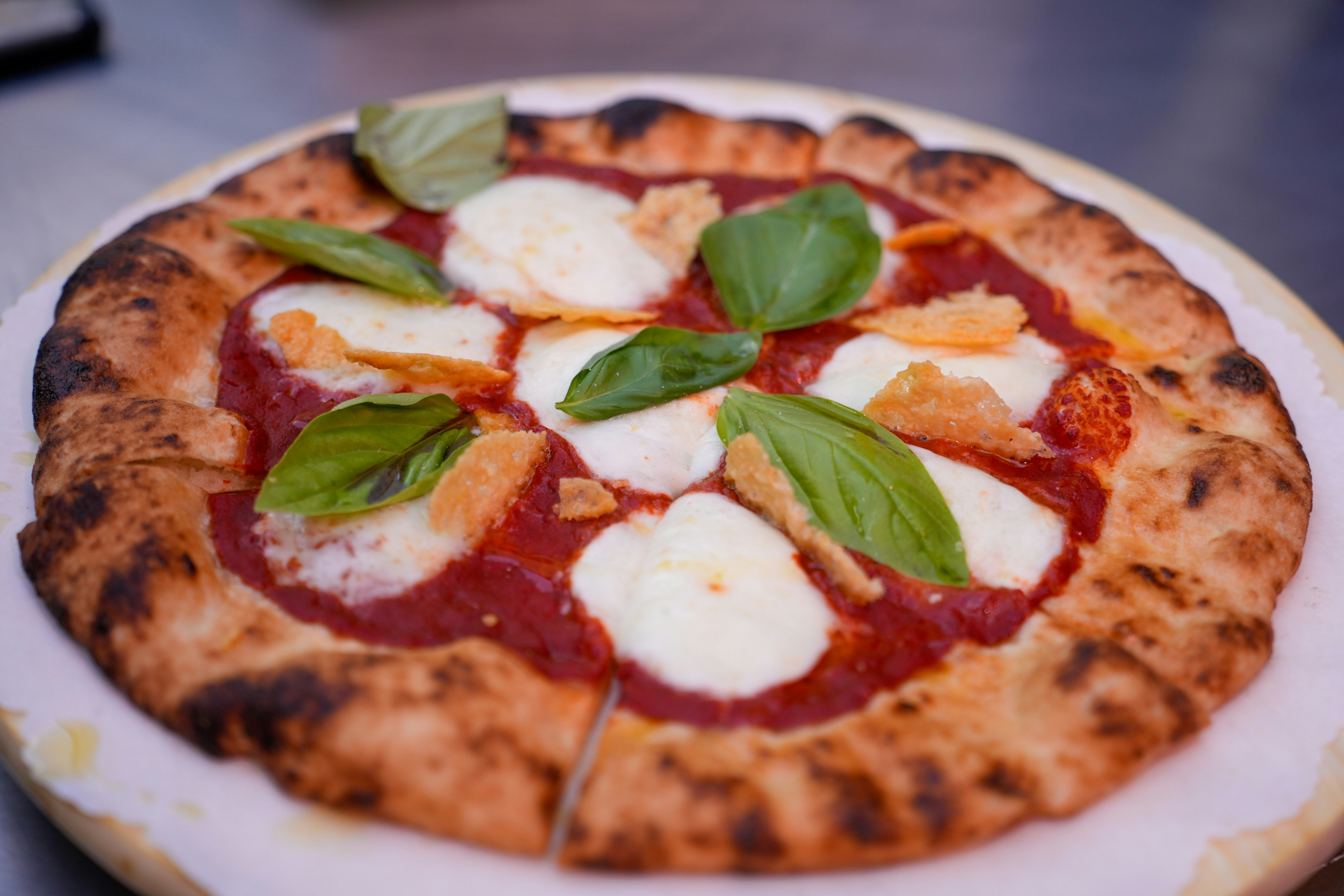 Heralded Slice: Fresh Basil Top on a Rustic Margherita