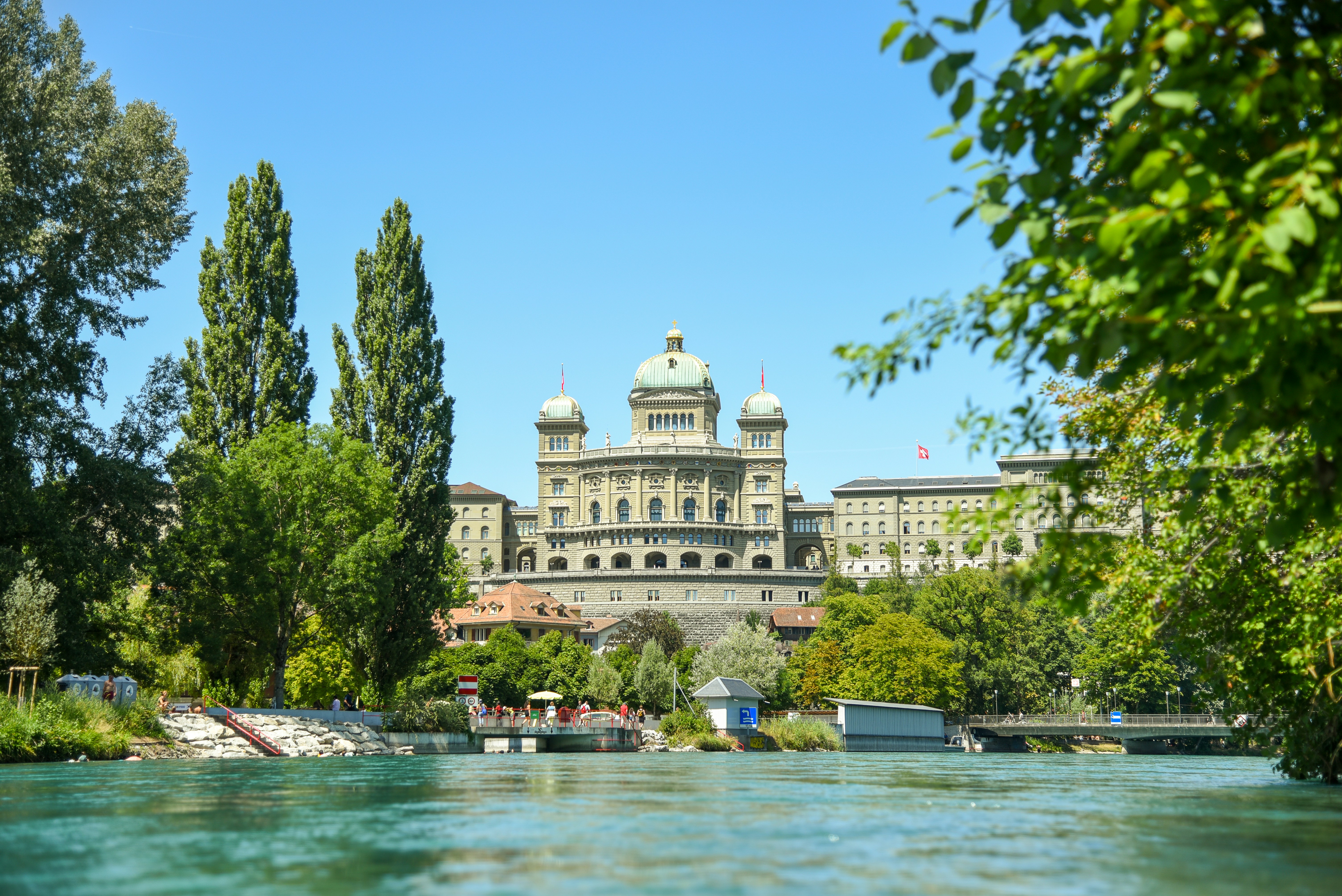 Benedictine Panorama: A Majestic City Facade Over a Serene River
