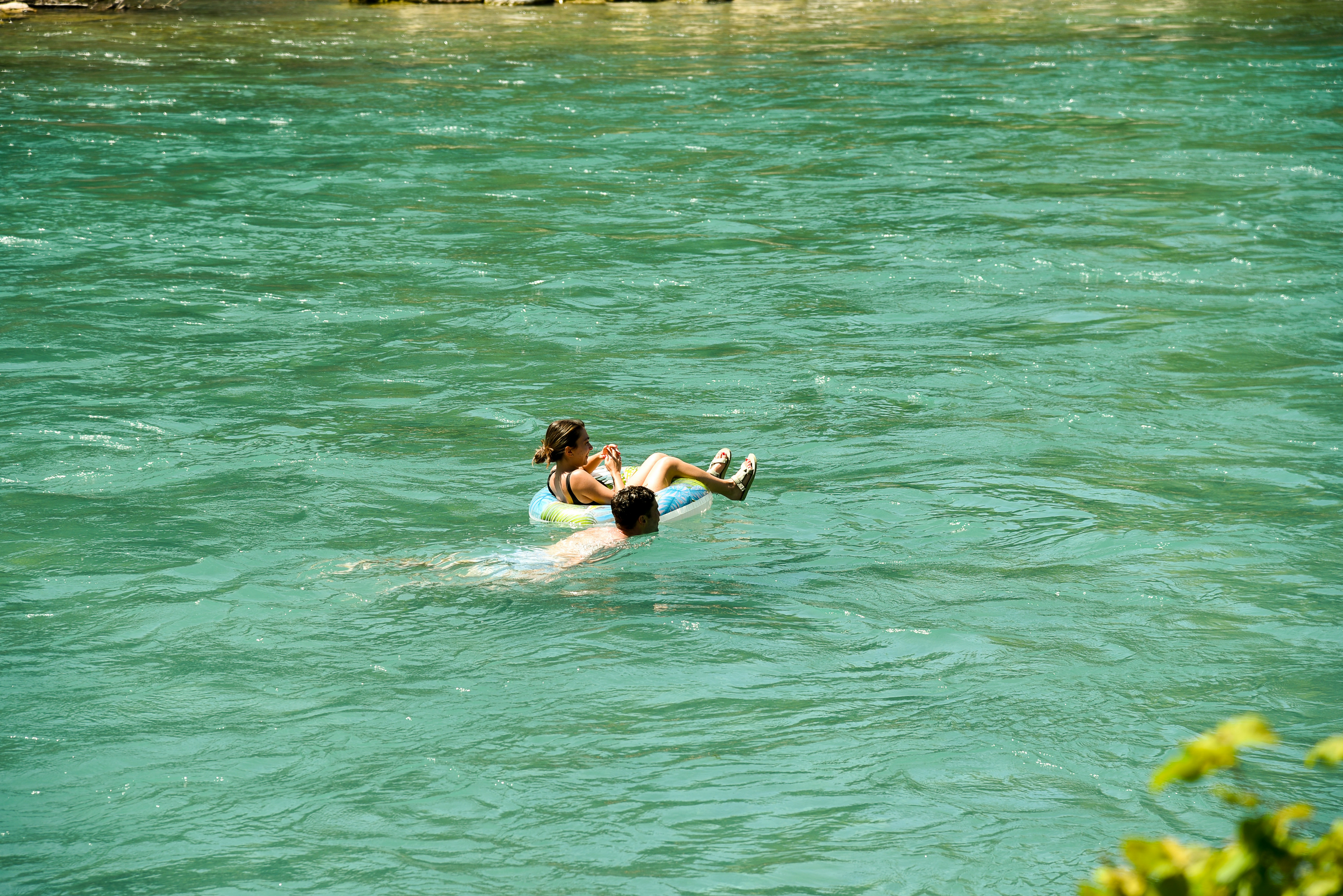 Floating Moment: A Couple in Turquoise Waters