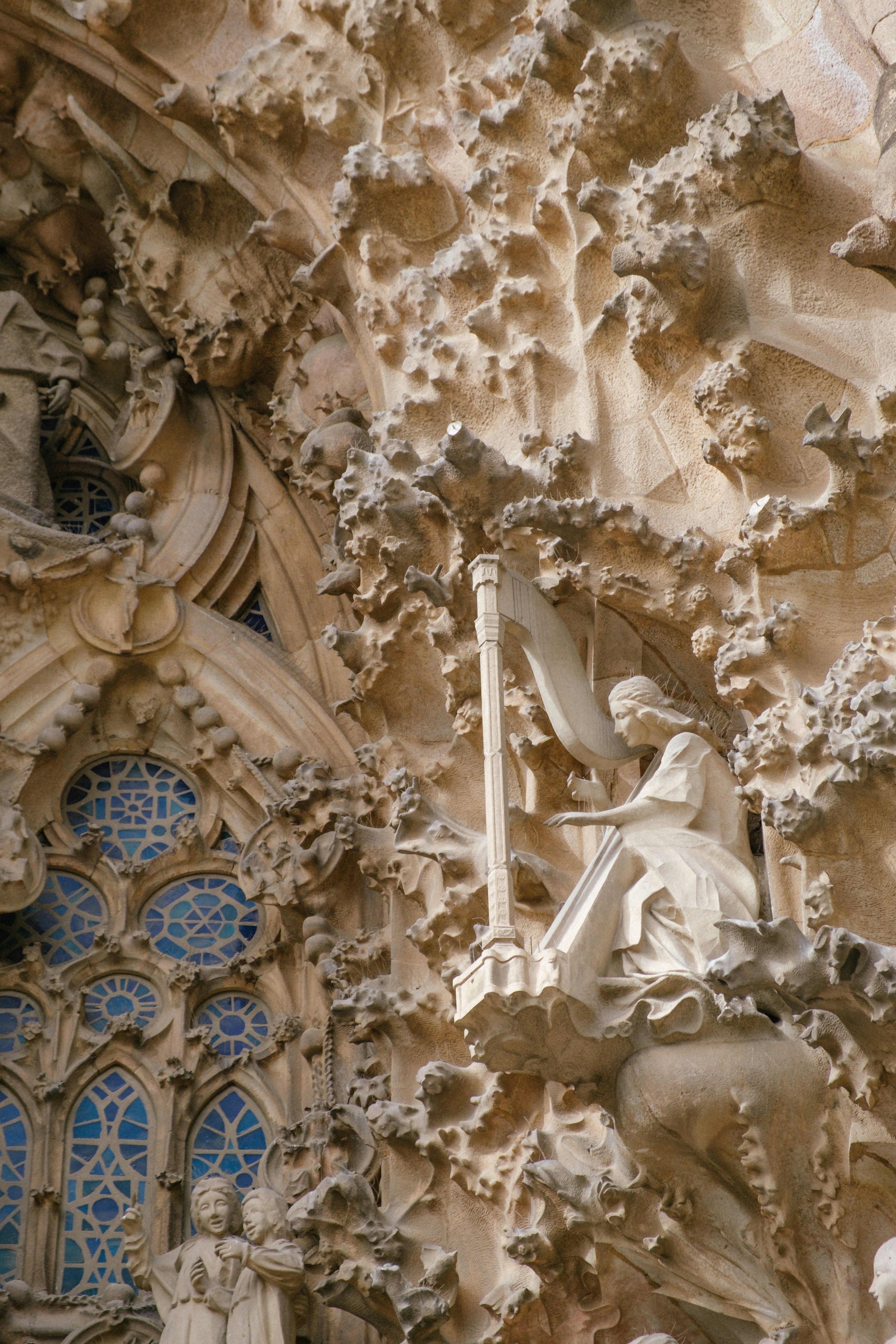 Stone Choir: A Gothic Angel Carved in Stone Beneath Ornate Arches