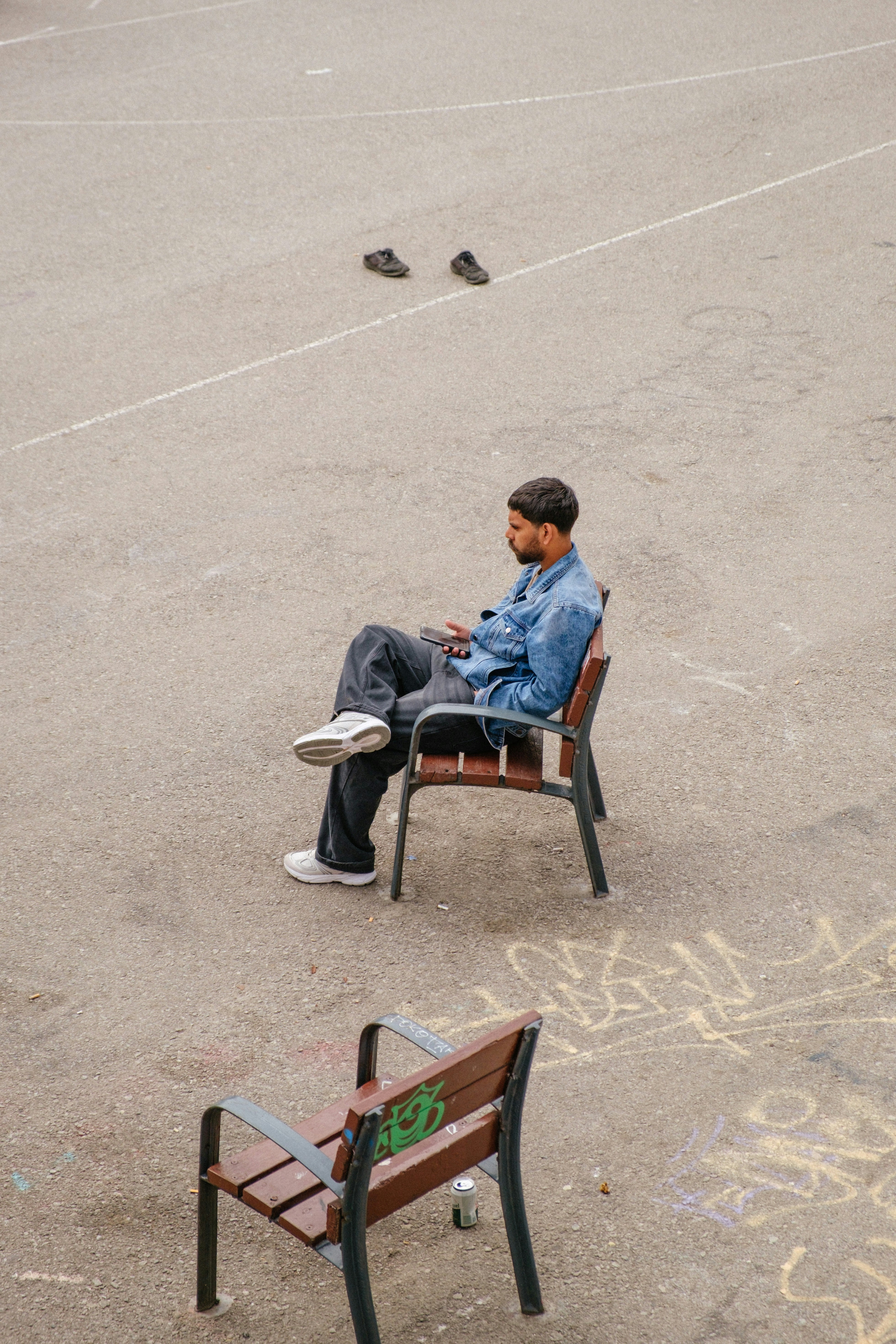 Midday Break: A Quiet Portrait on the Baked Playground