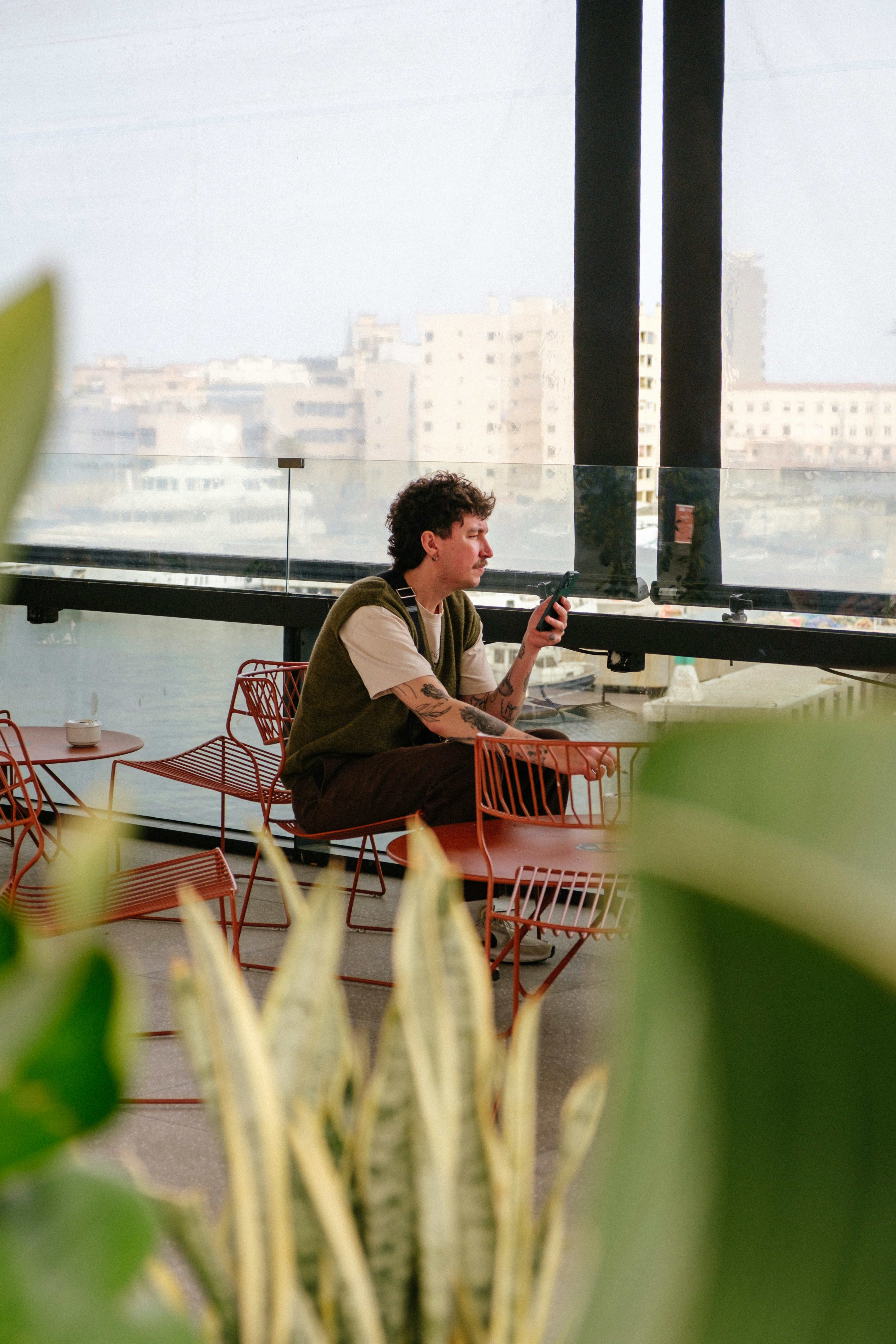 Man on a Terrace: Quiet Attention by the Water