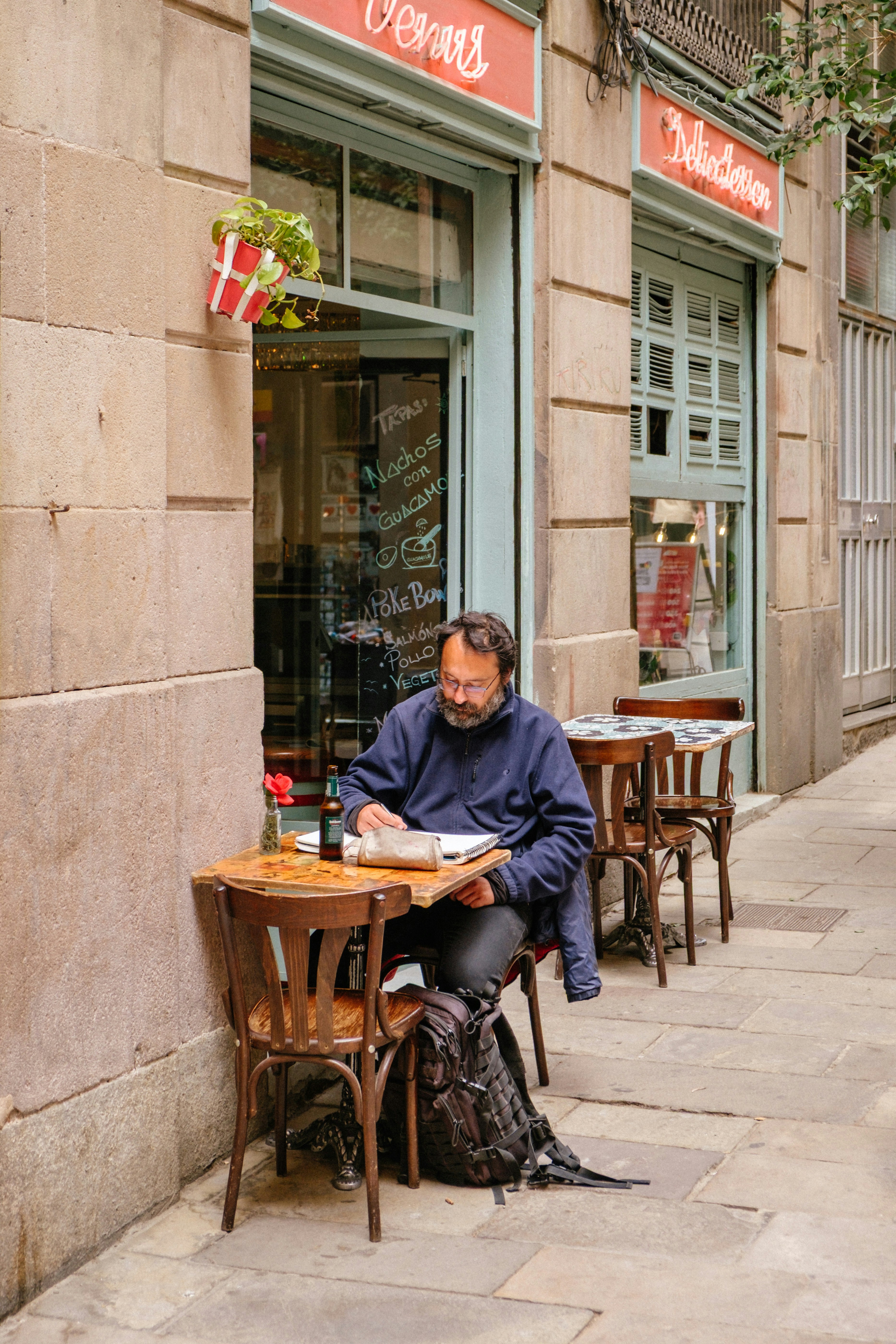 Cafe Scholar: A Quiet Moment on a Barcelona Lane