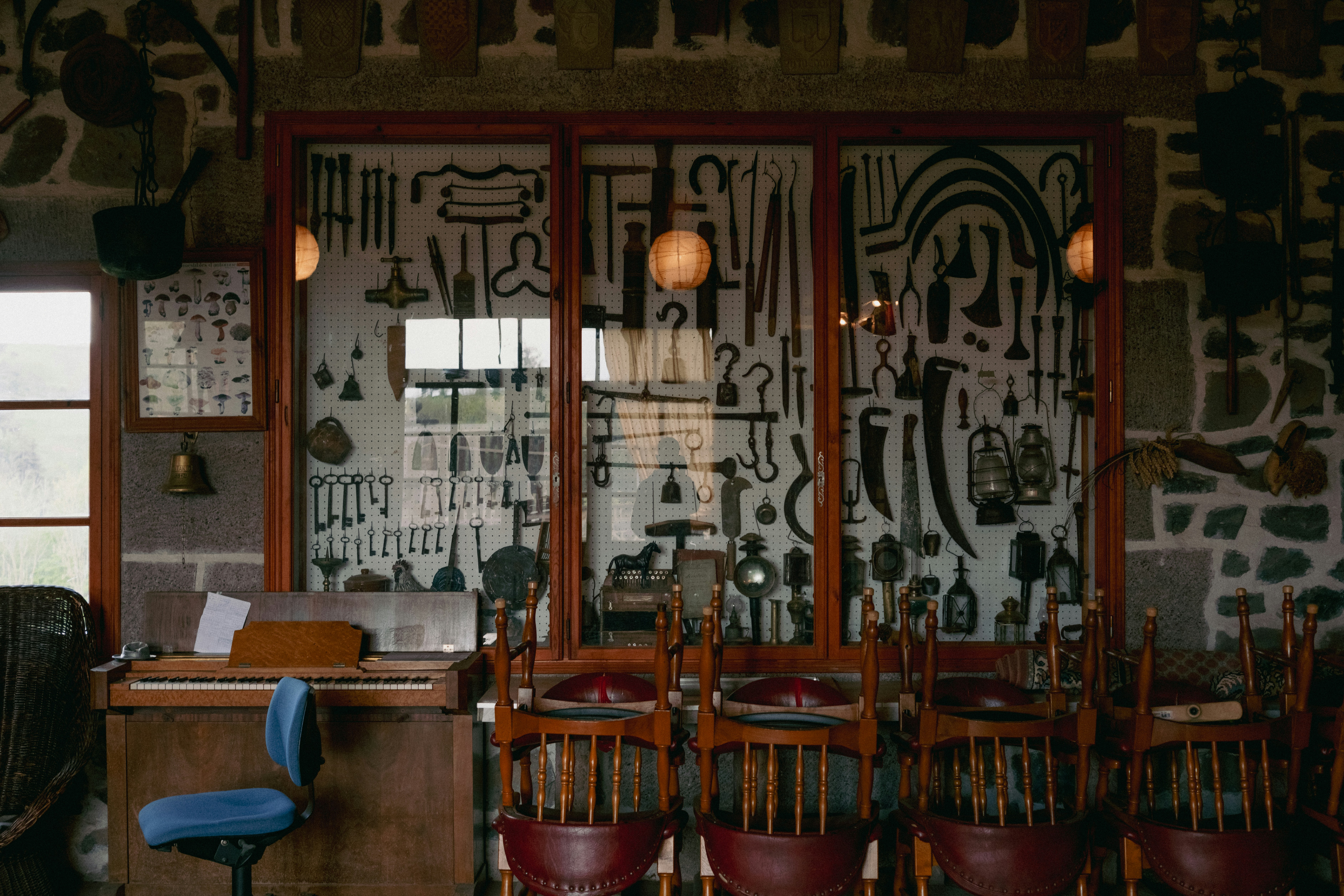 Heritage Workshop: Tools on Display and a Row of Wooden Chairs