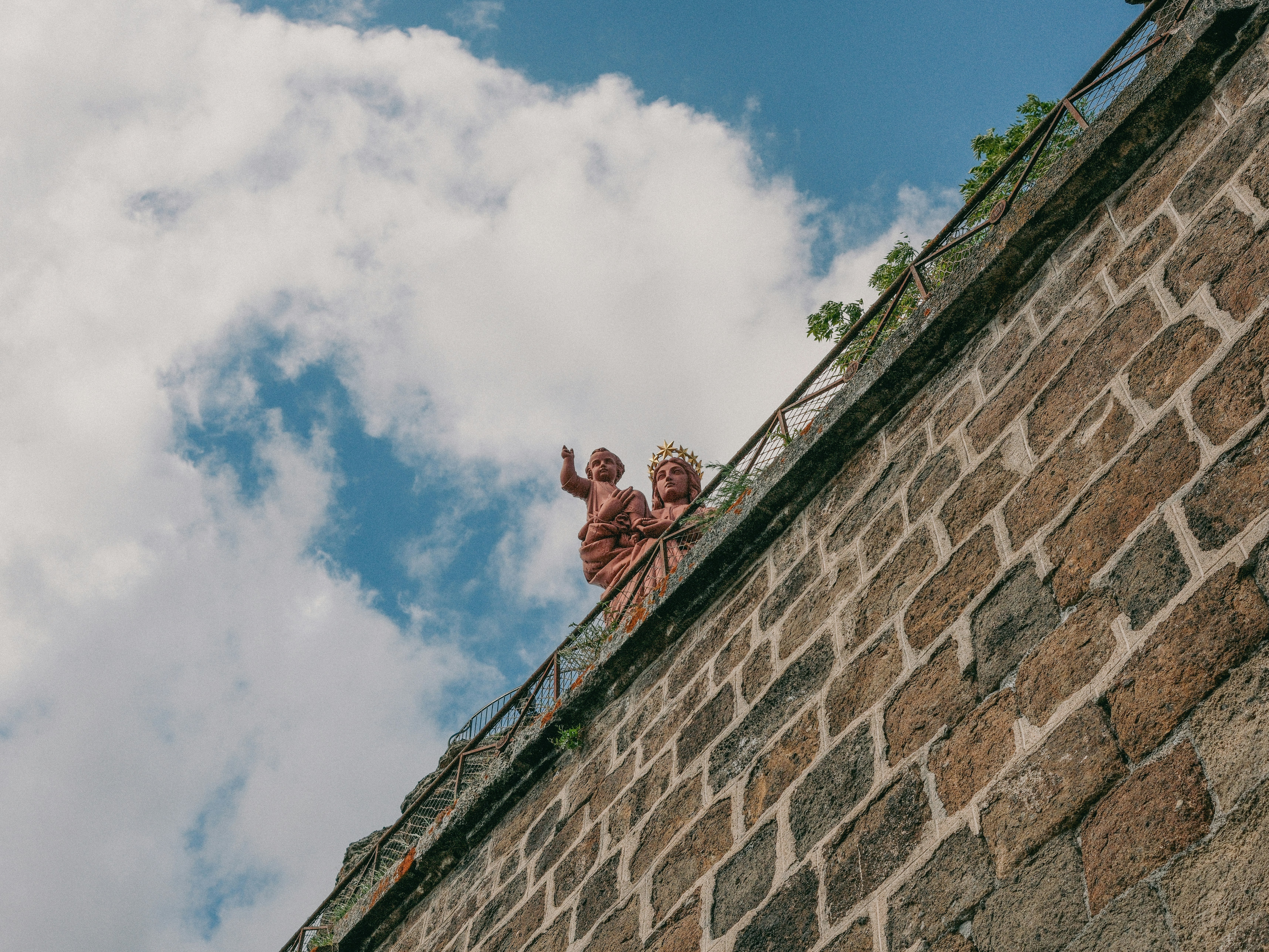 Gazing Over the Wall: A Pair on the City’s Edge