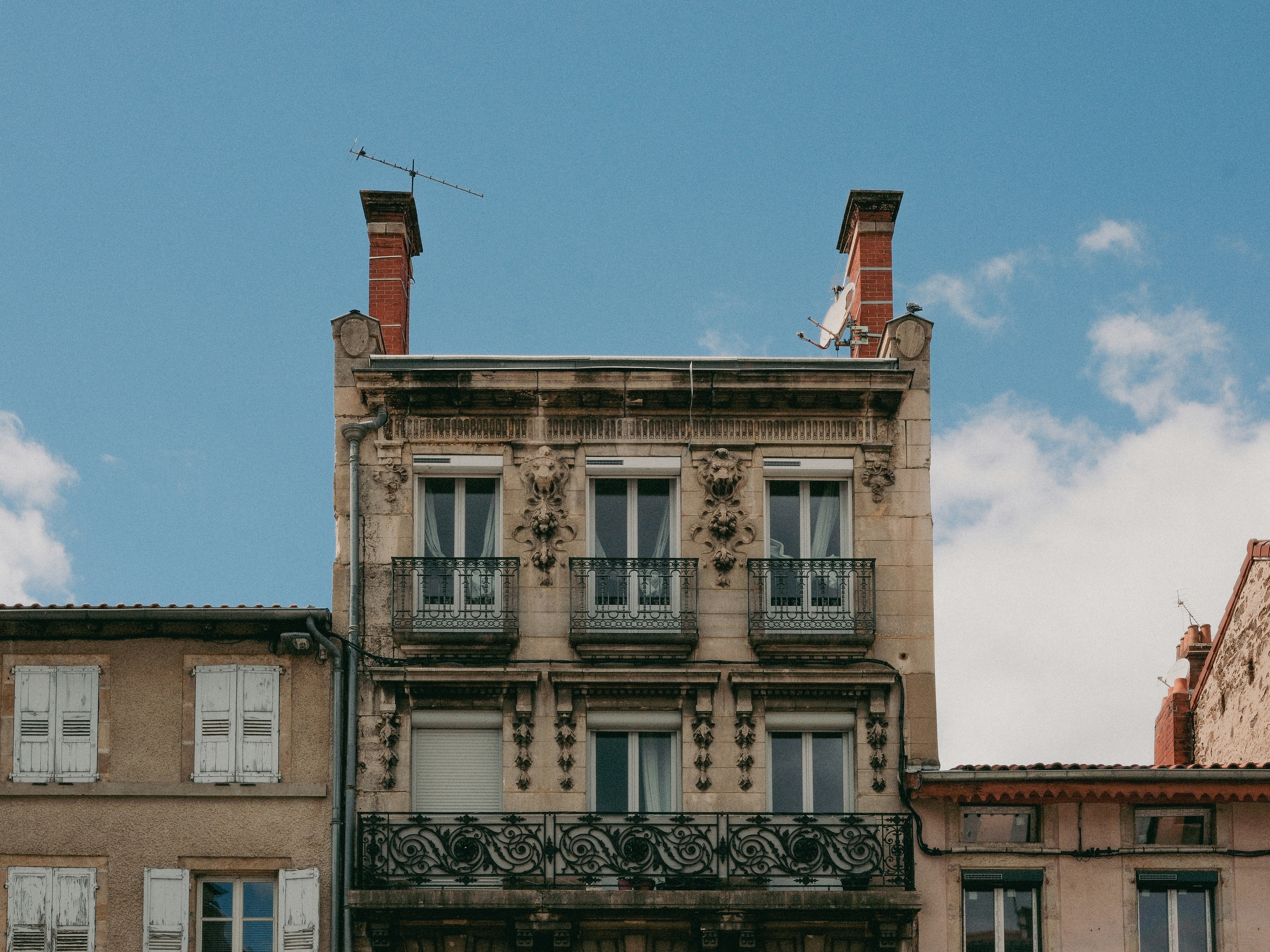 Ornate Facade with Central Balcony Windows