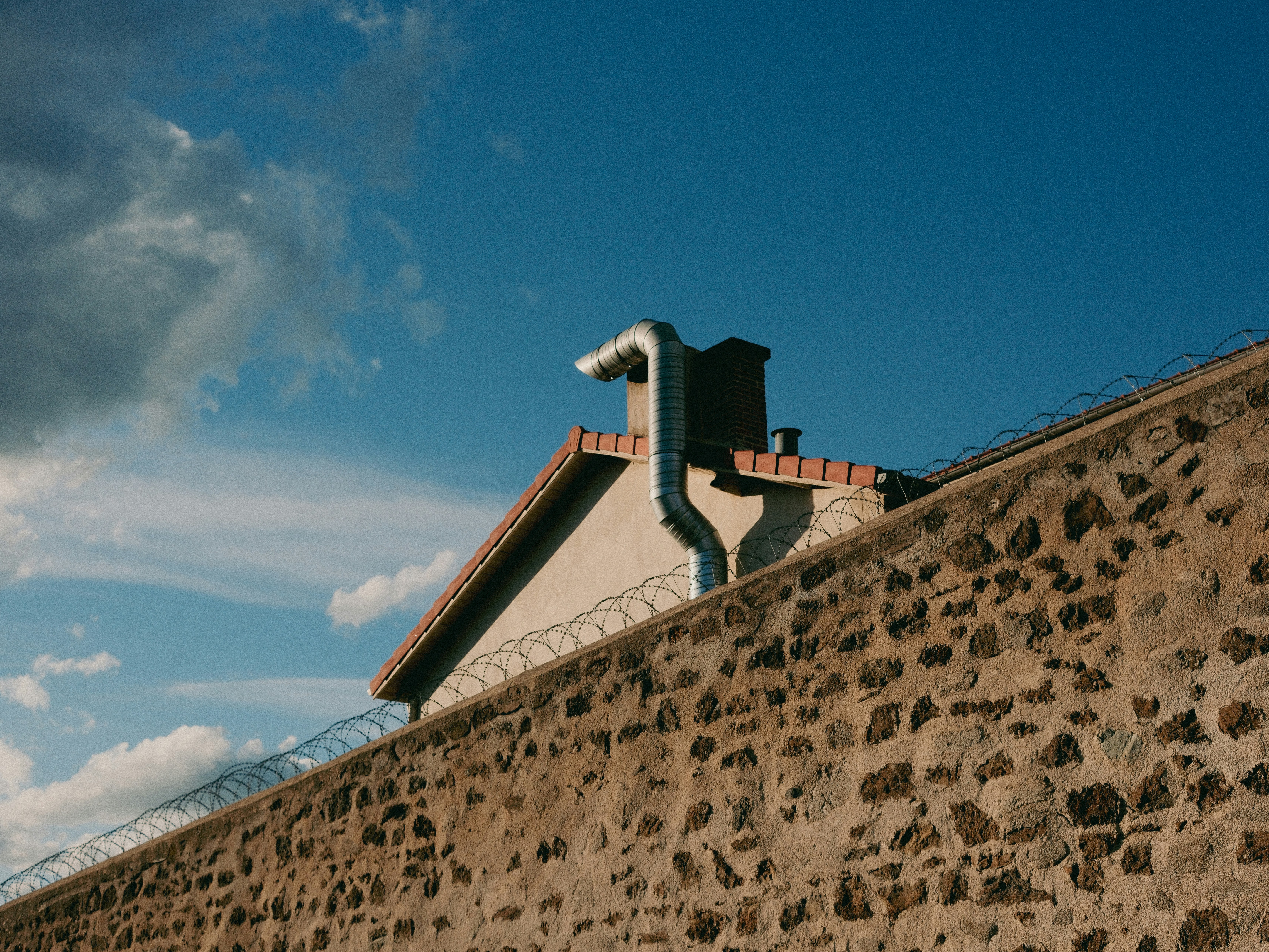 Barbed Perimeter Under a Clear Sky