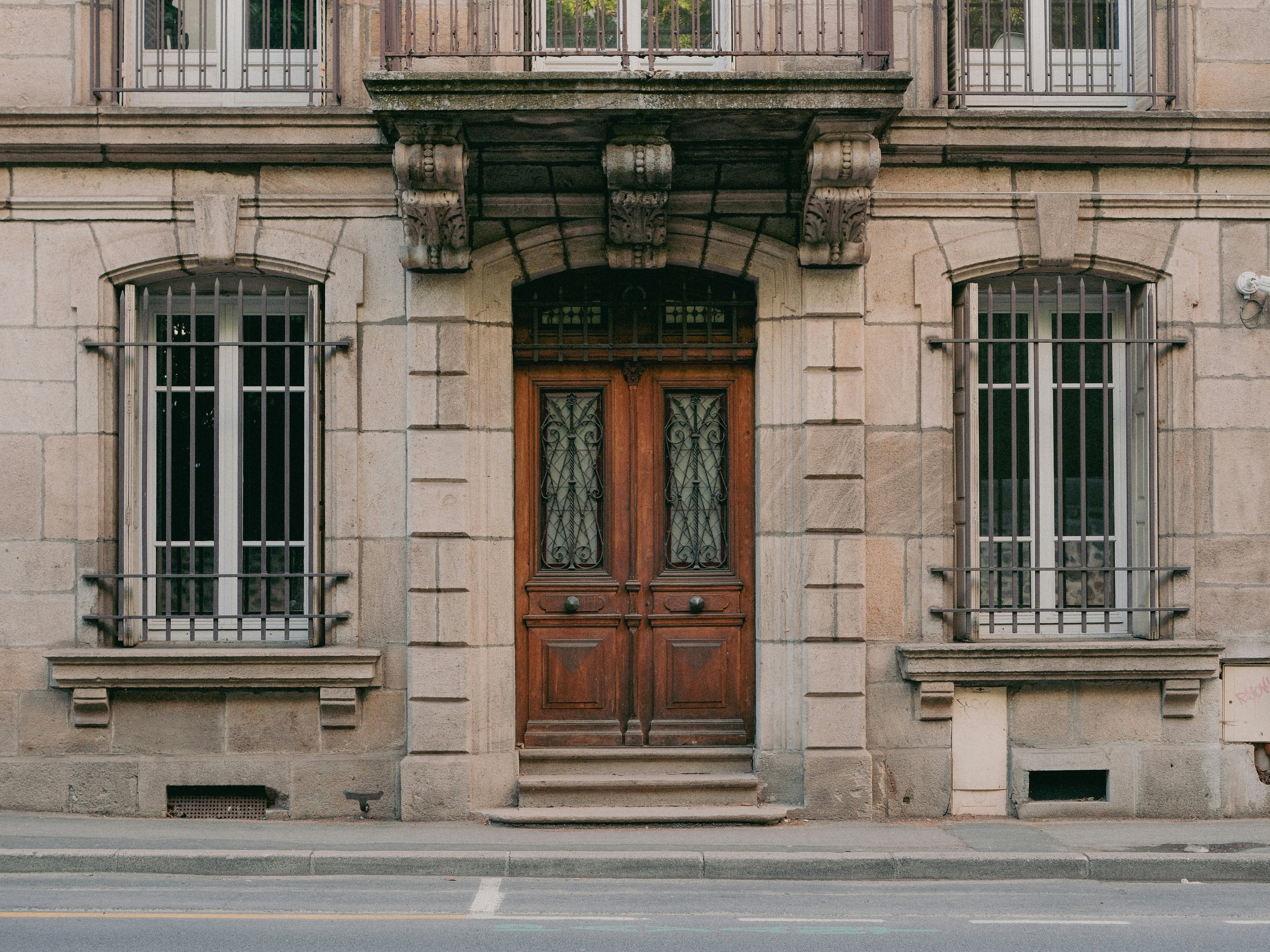 Weathered Mansion Doorway: A Quiet Urban Facade