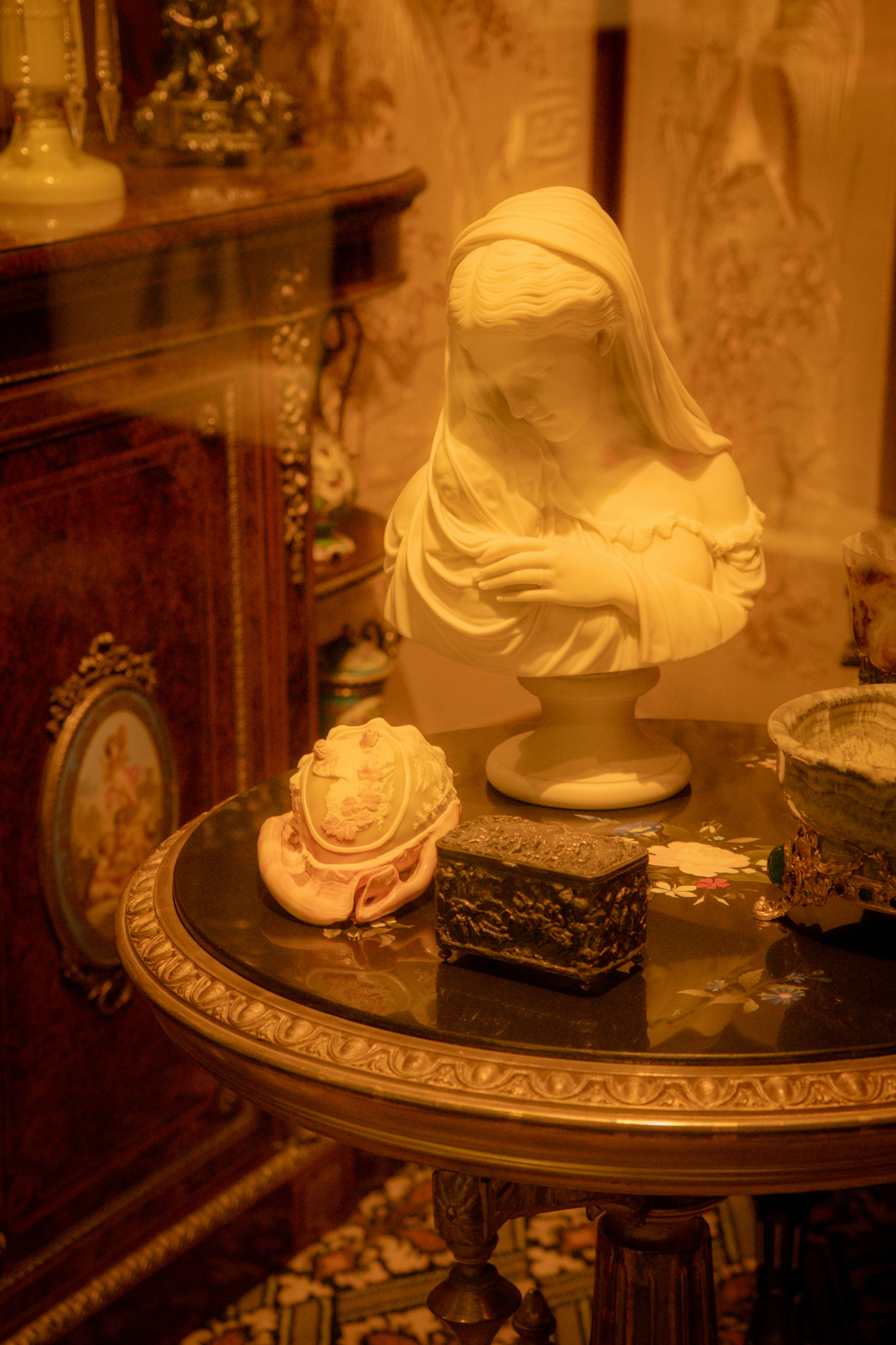 Still Life of Victorian Treasures: A Warm Glimpse Through Amber Light