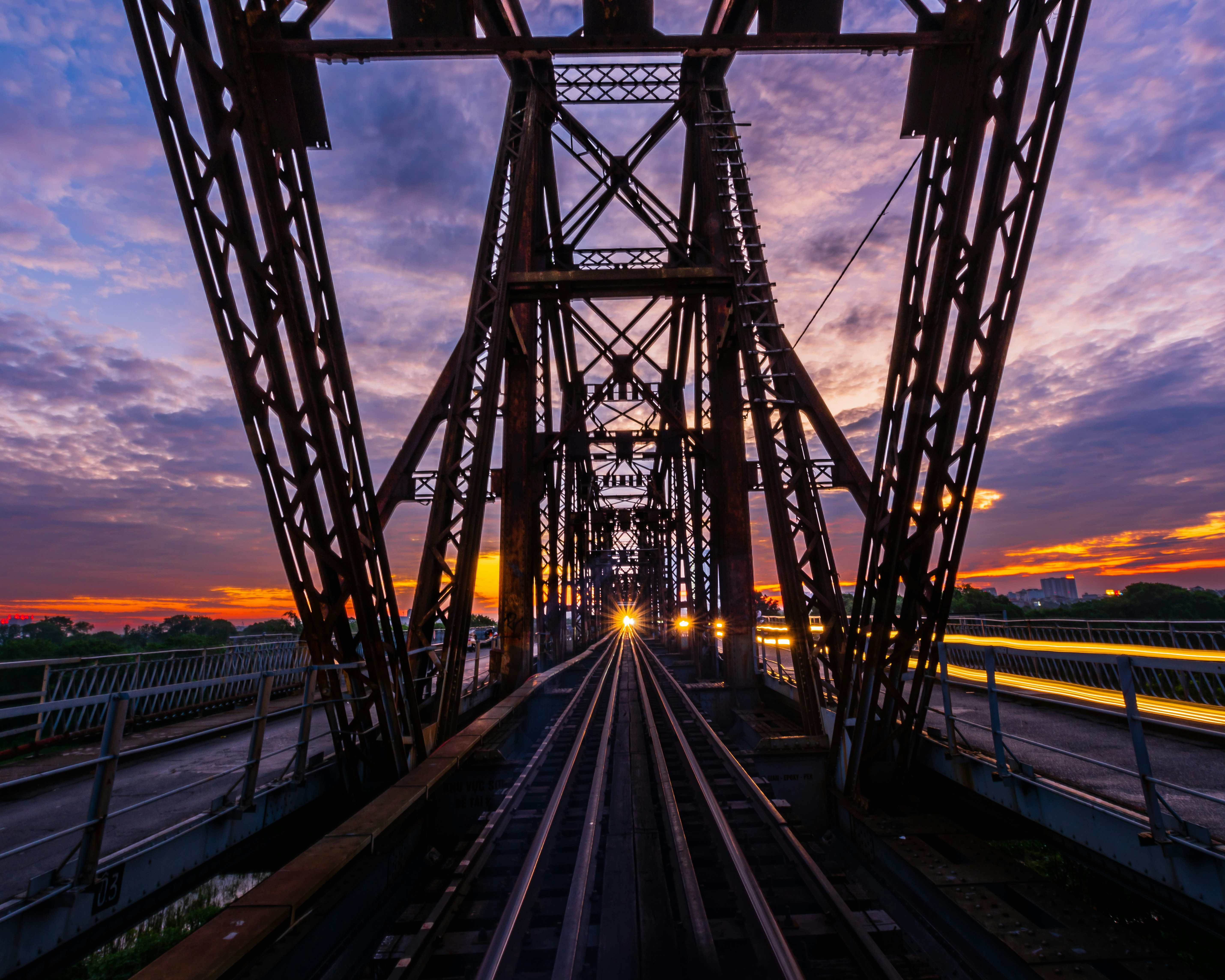 Rising Rails: Sunset Light Through a Steel Spine