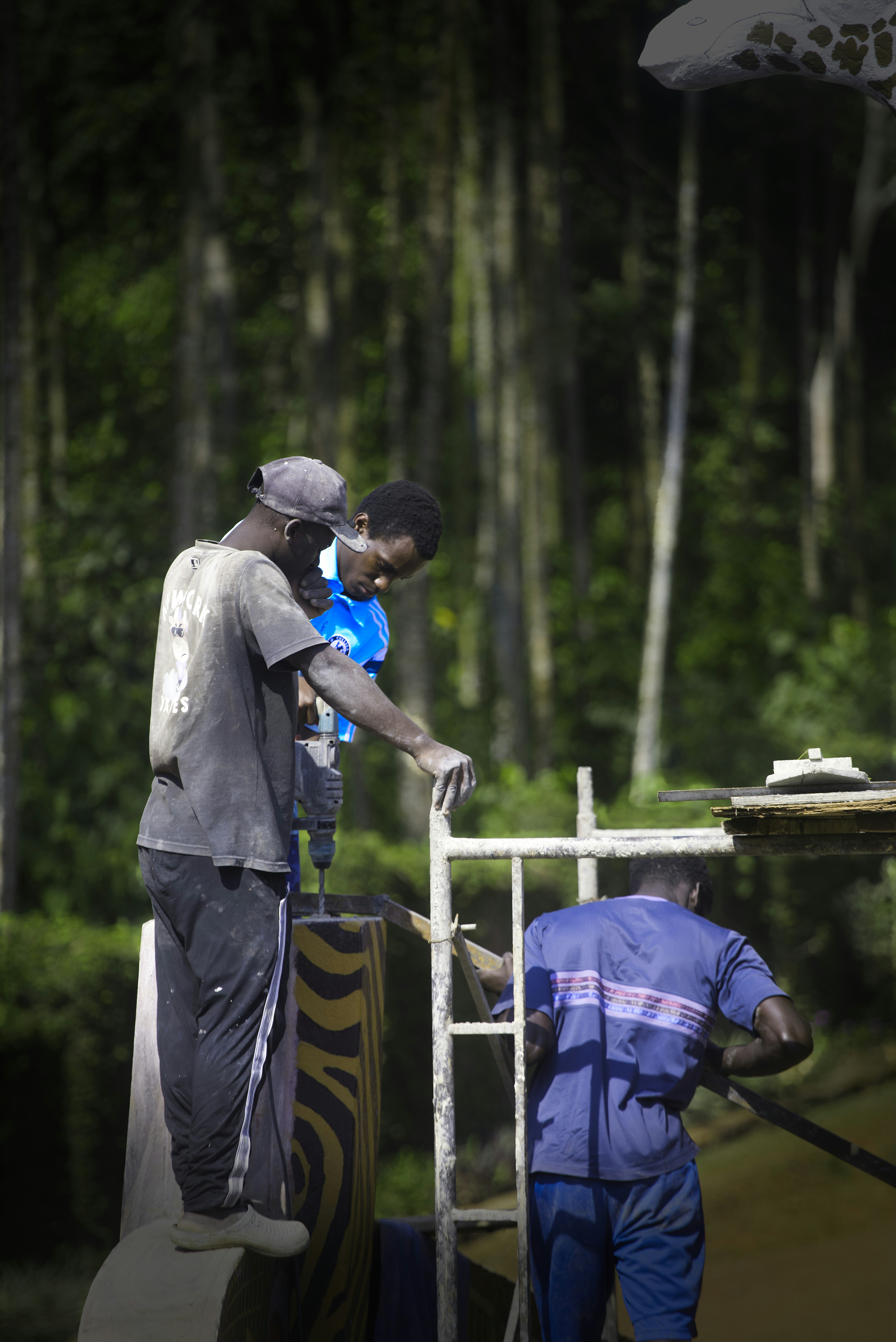 Hands at Work: Crewman Balances Tools on a Narrow Platform