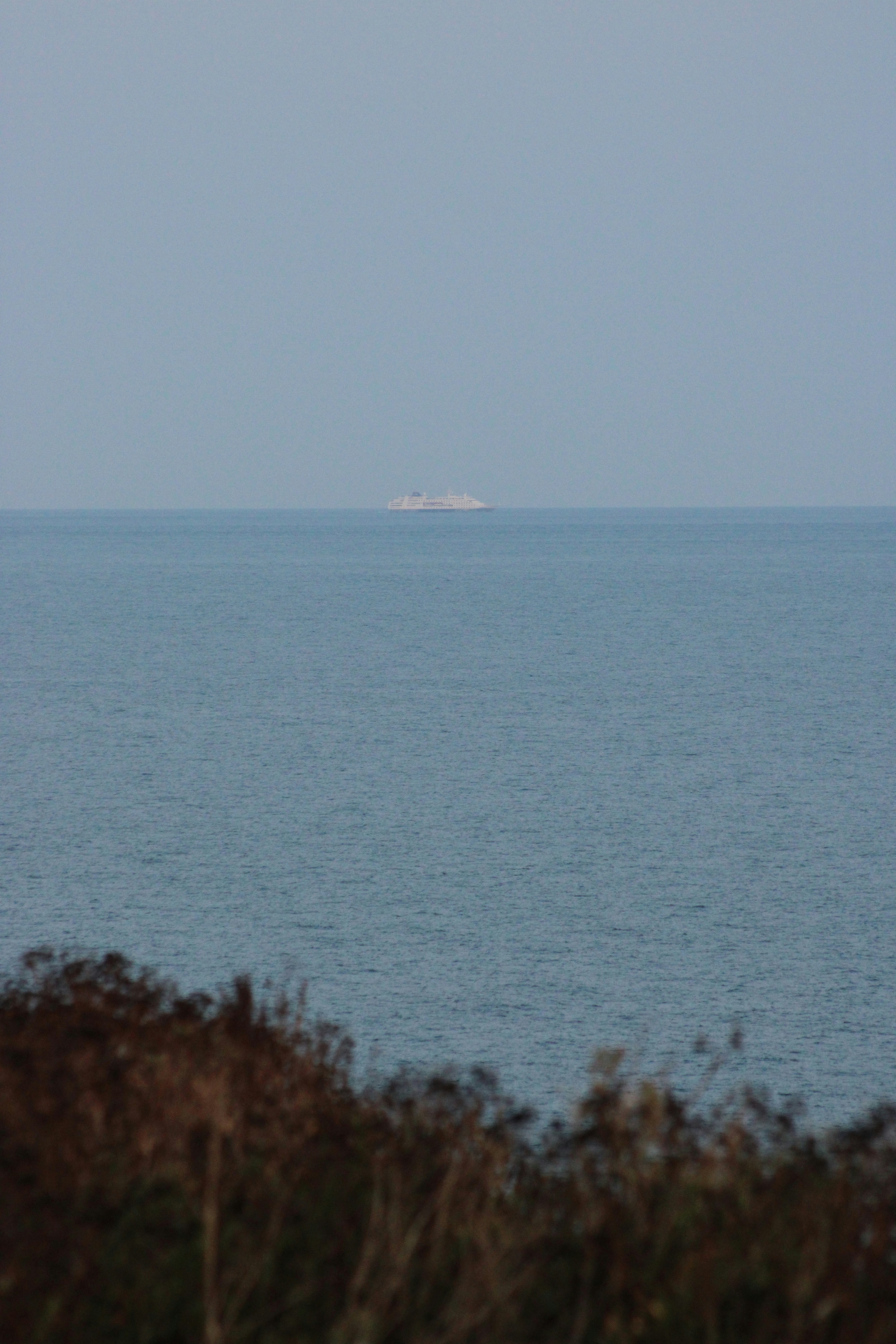 Far Horizon Vessel: A Quiet Sea Boat on the Distant Calm