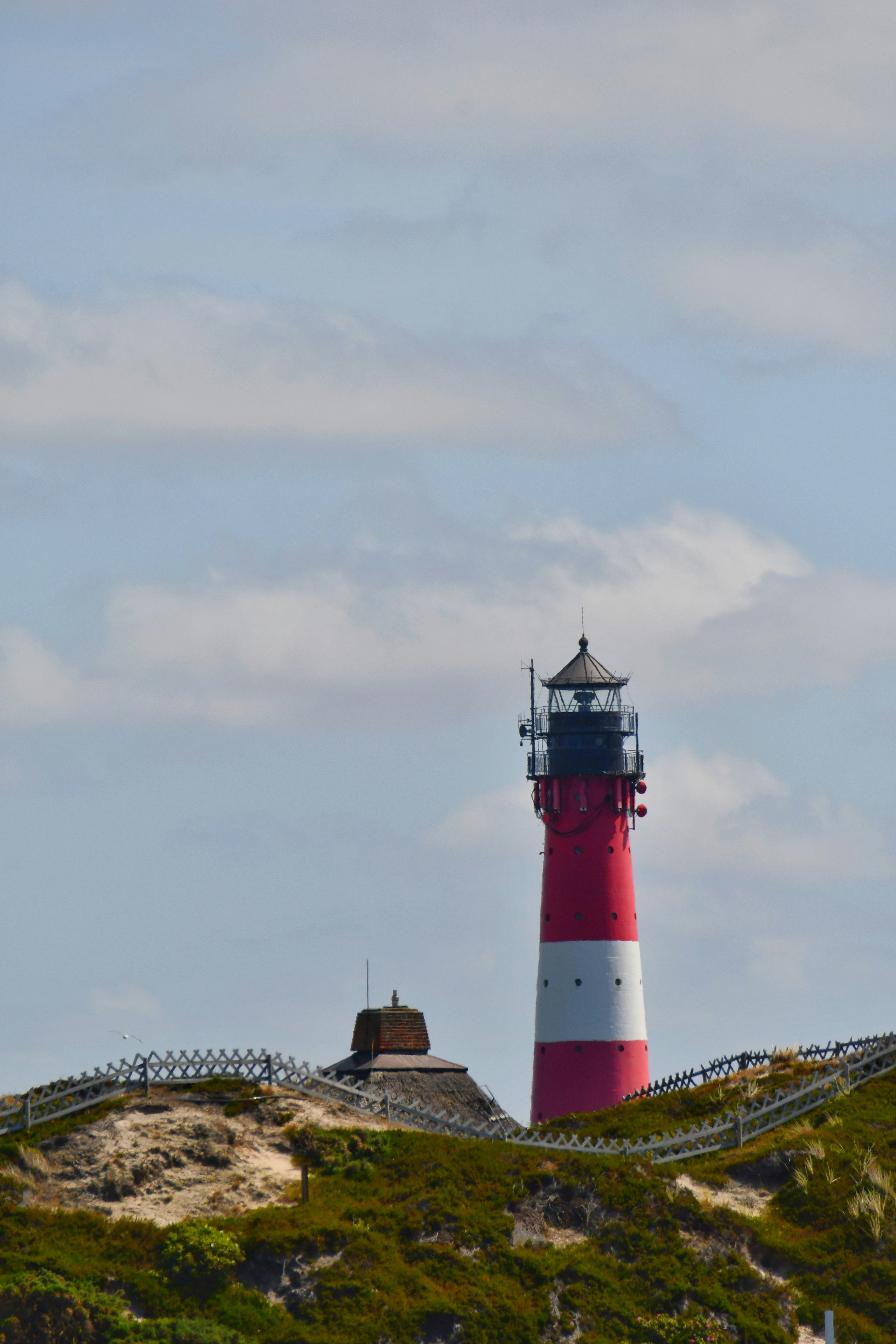 Red Beacon on the Dunes: Lighthouse Standstill