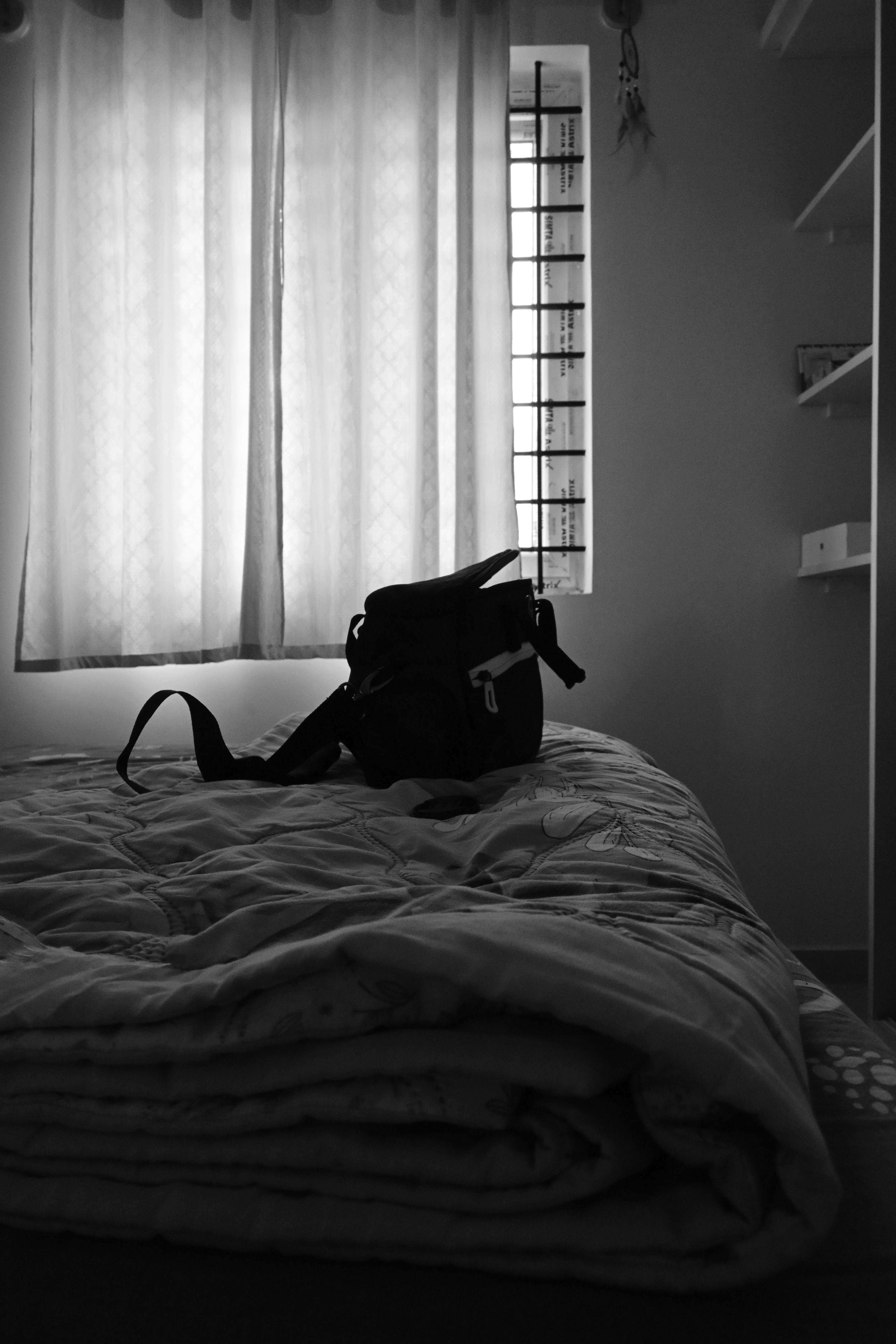 Silent Morning in Gray Quilt: A Bag on the Bed by the Window