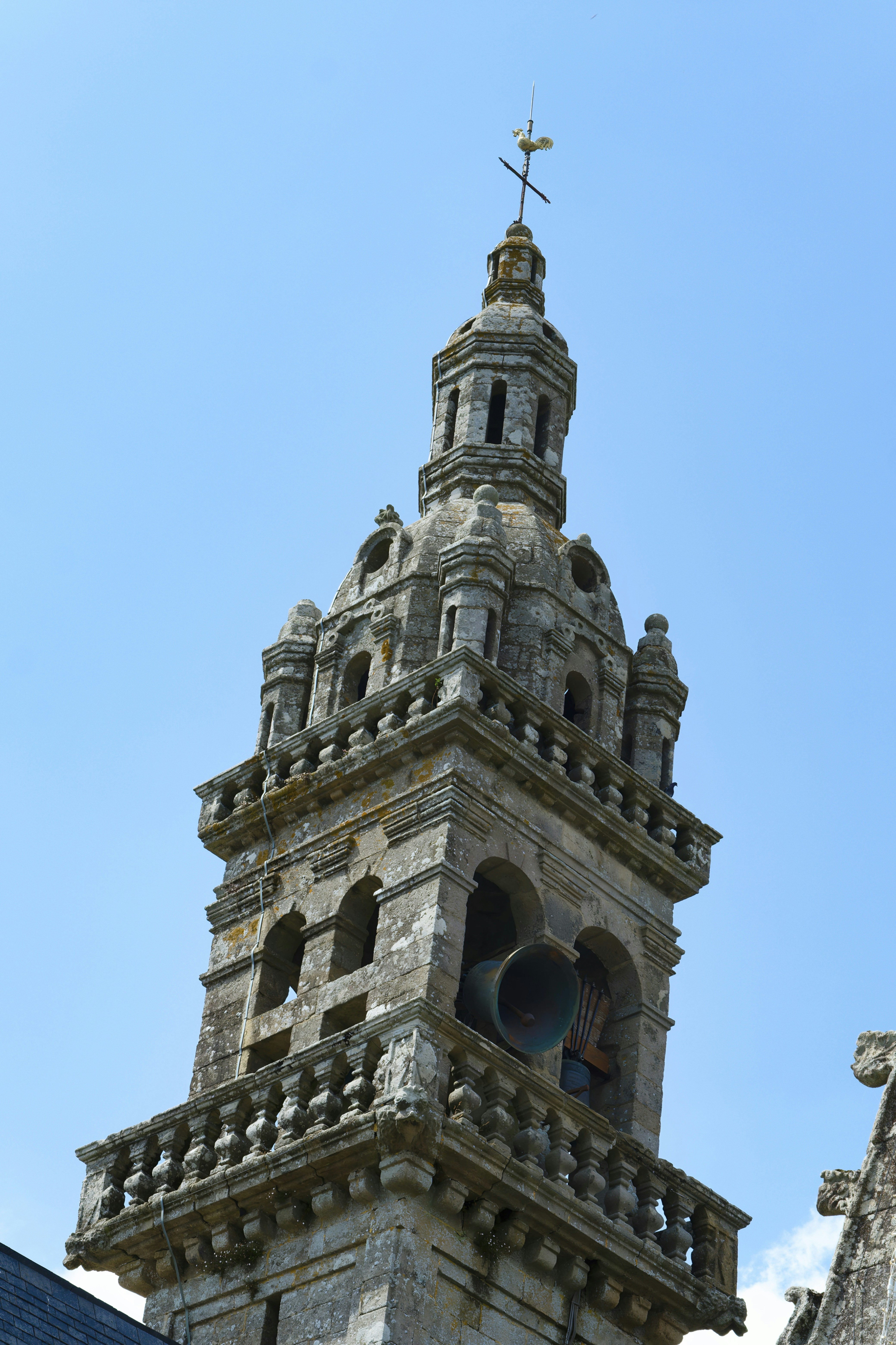 Stone Bell Tower Reaching Toward a Clear Blue Sky