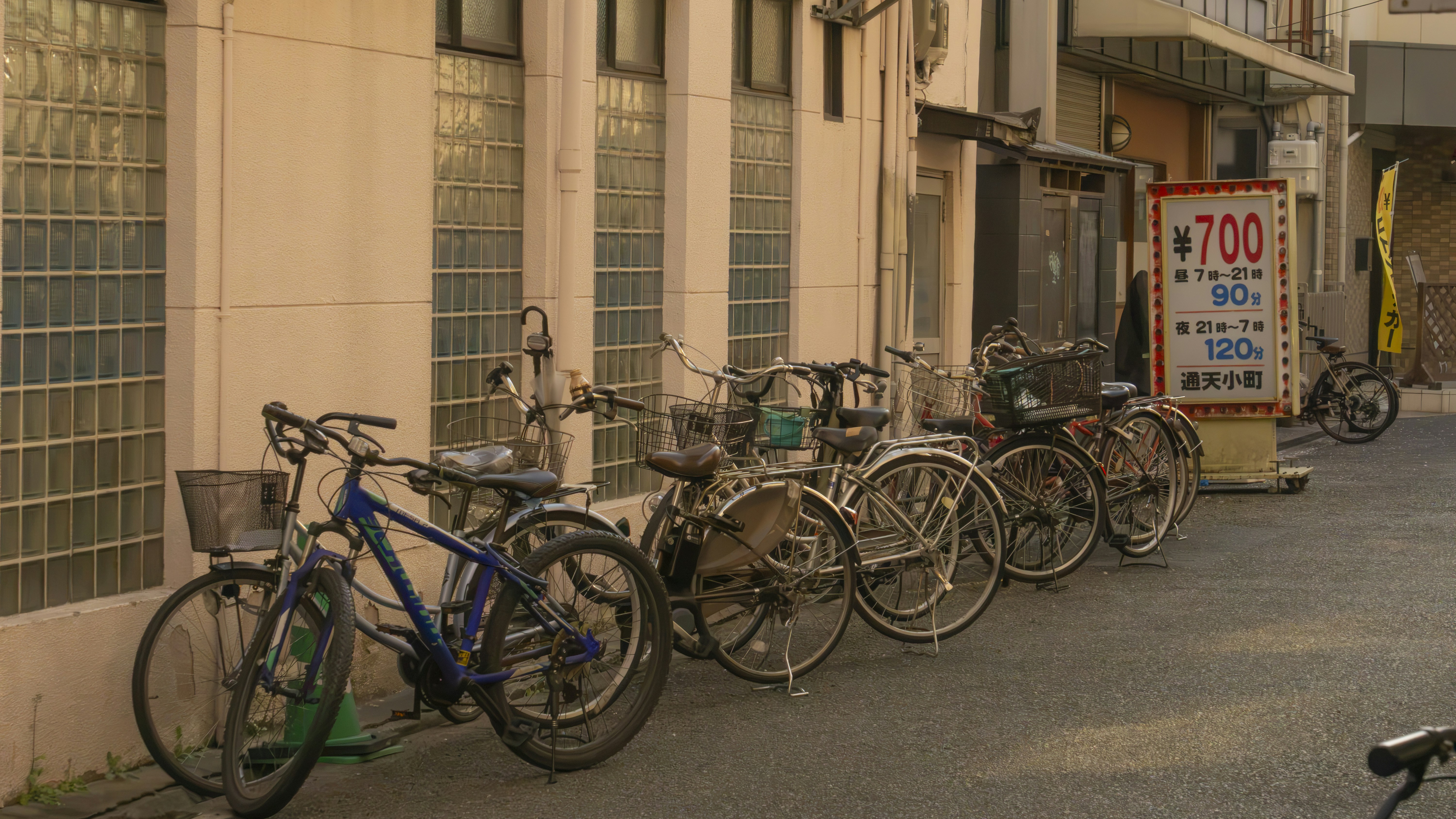 Bicycle Row Near a Sunlit Alley