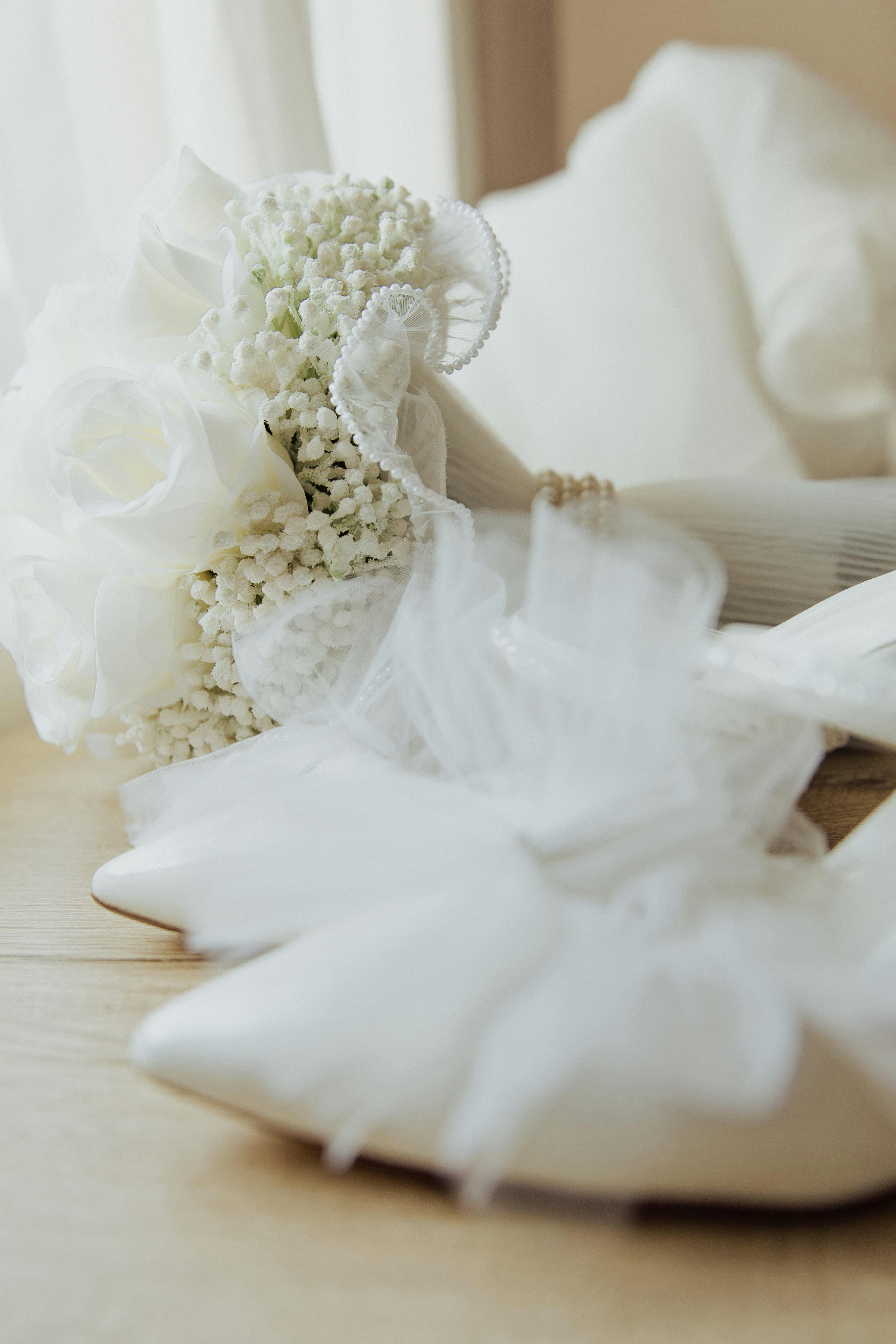 Whispering White: A Bridal Bouquet Resting by Soft Light