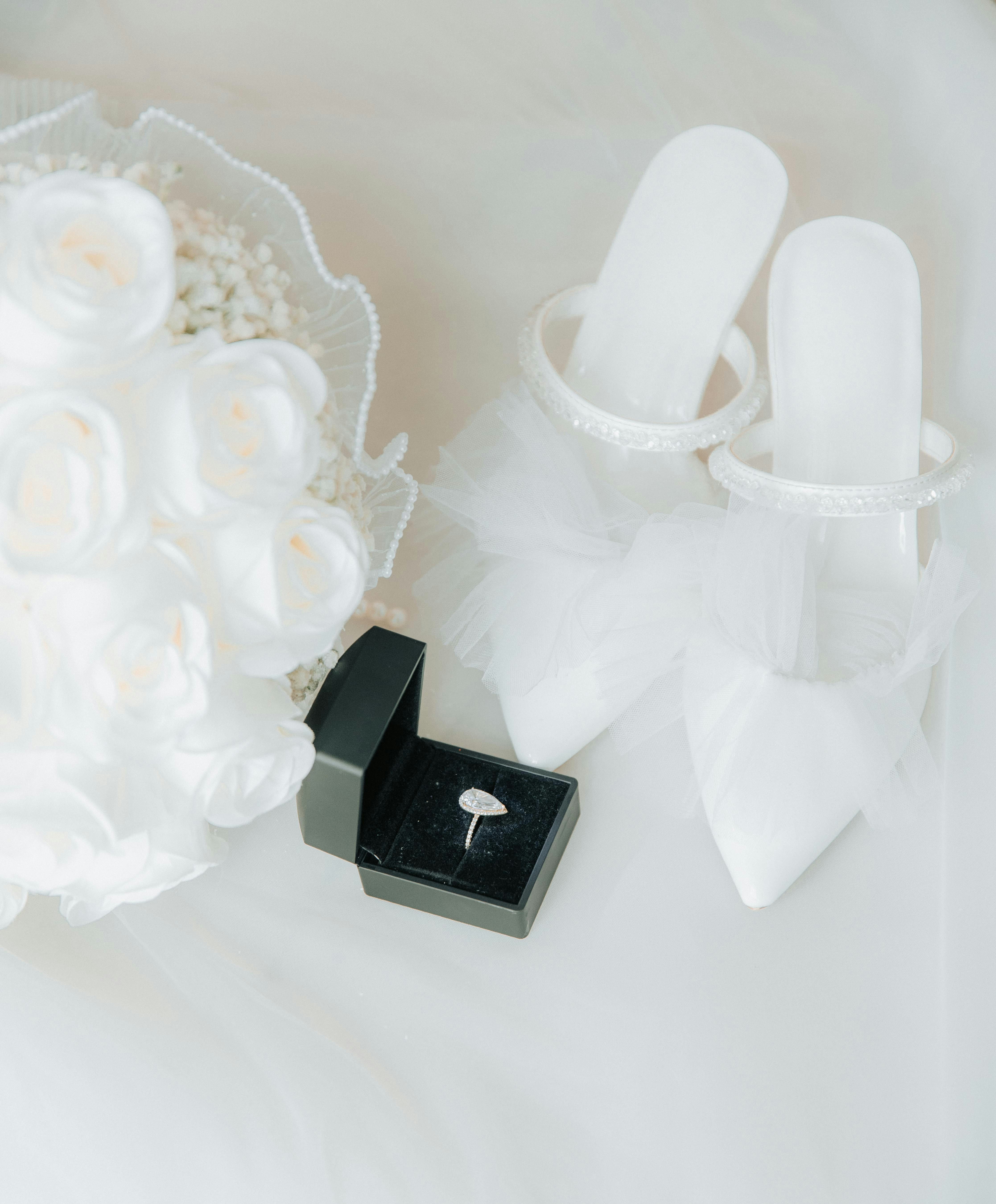 White Bouquet, Velvet Ring Box, and Twin Ivory Heels: A Moment of Bride’s Details