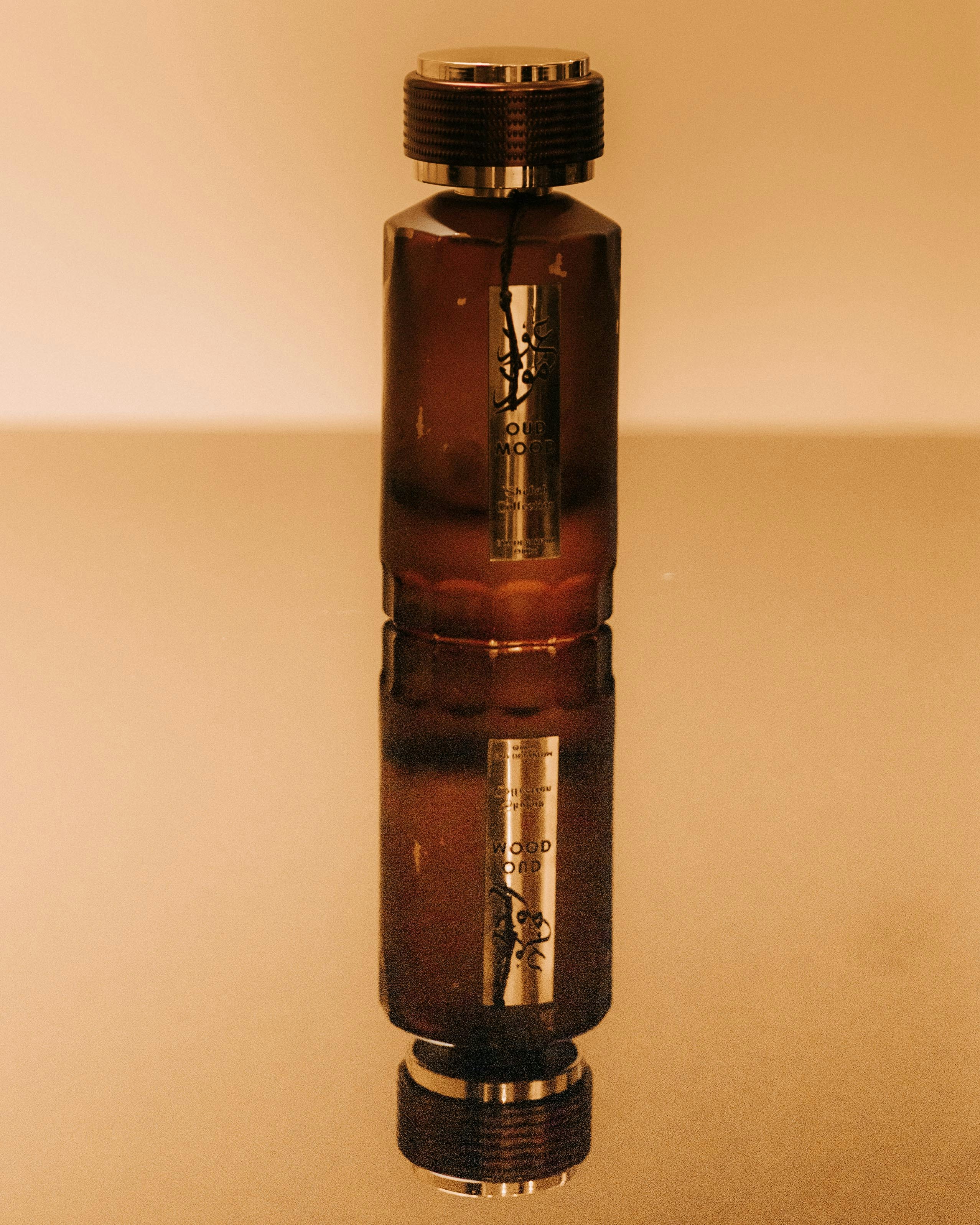 Amber-tinted Glass Capsule: A Symmetrical Studio Still