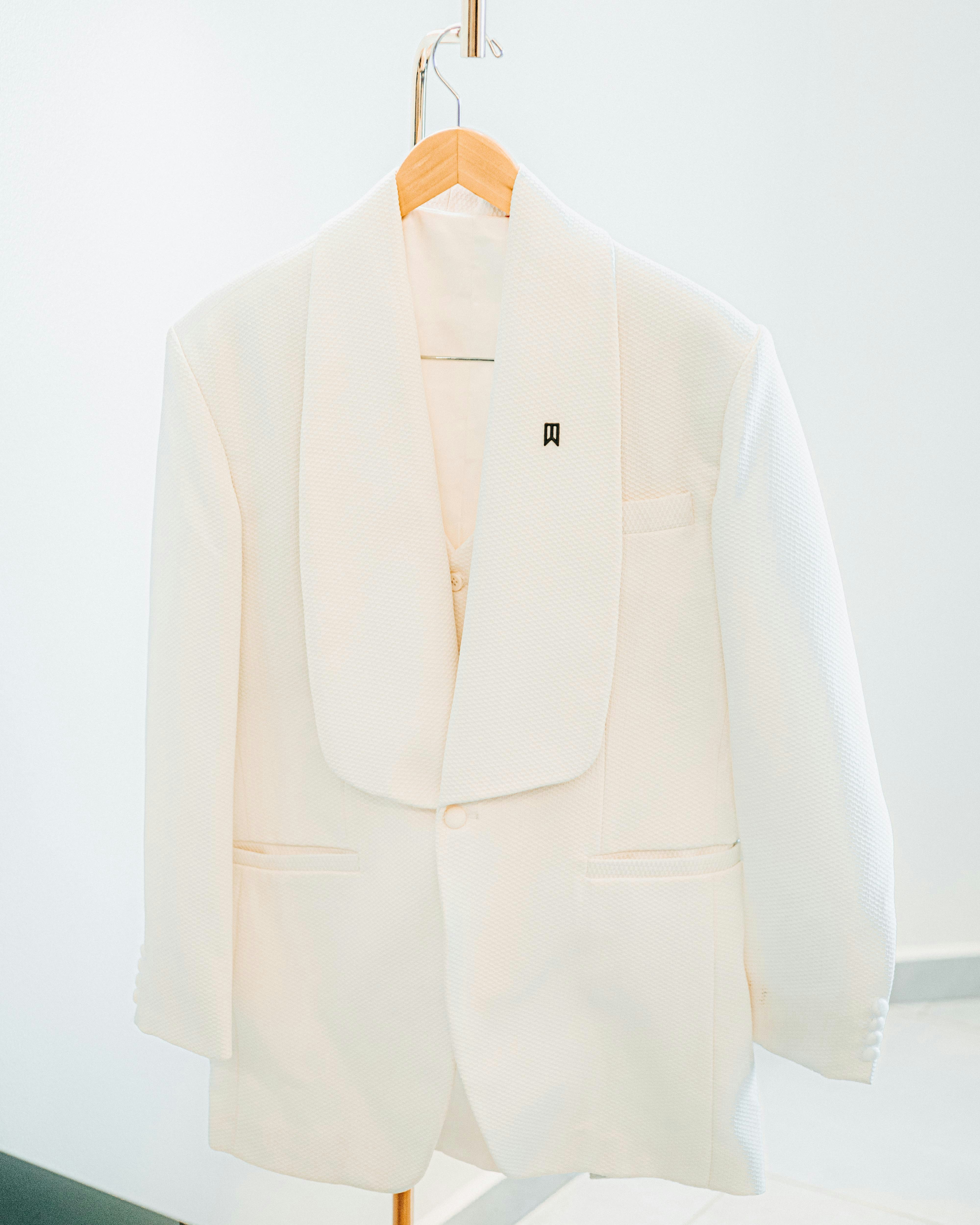 Minimalist Ivory Blazer on a Wooden Hanger