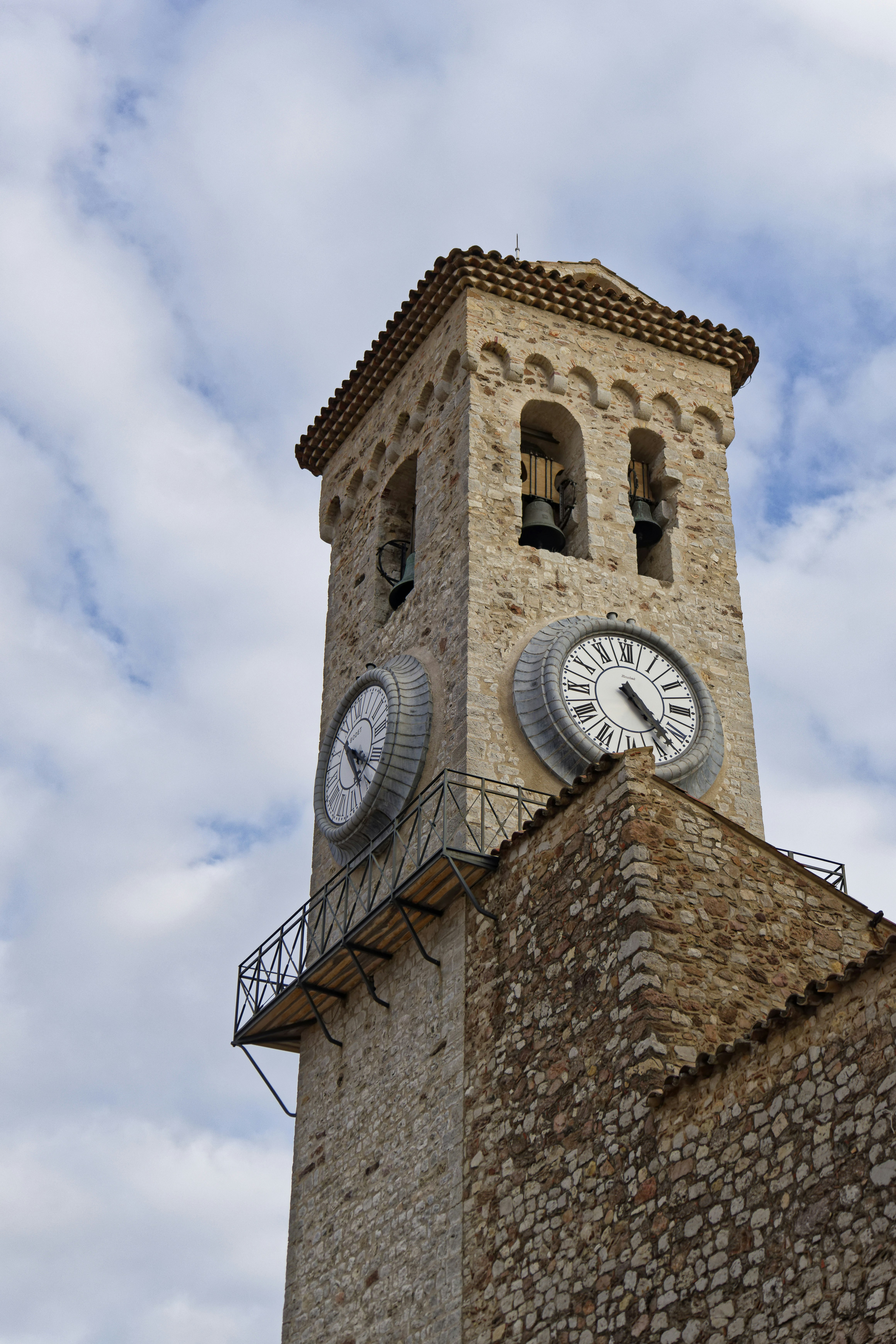 Clock Tower in Stone: A Sunlit Bell-Tower Reaches Toward the Sky