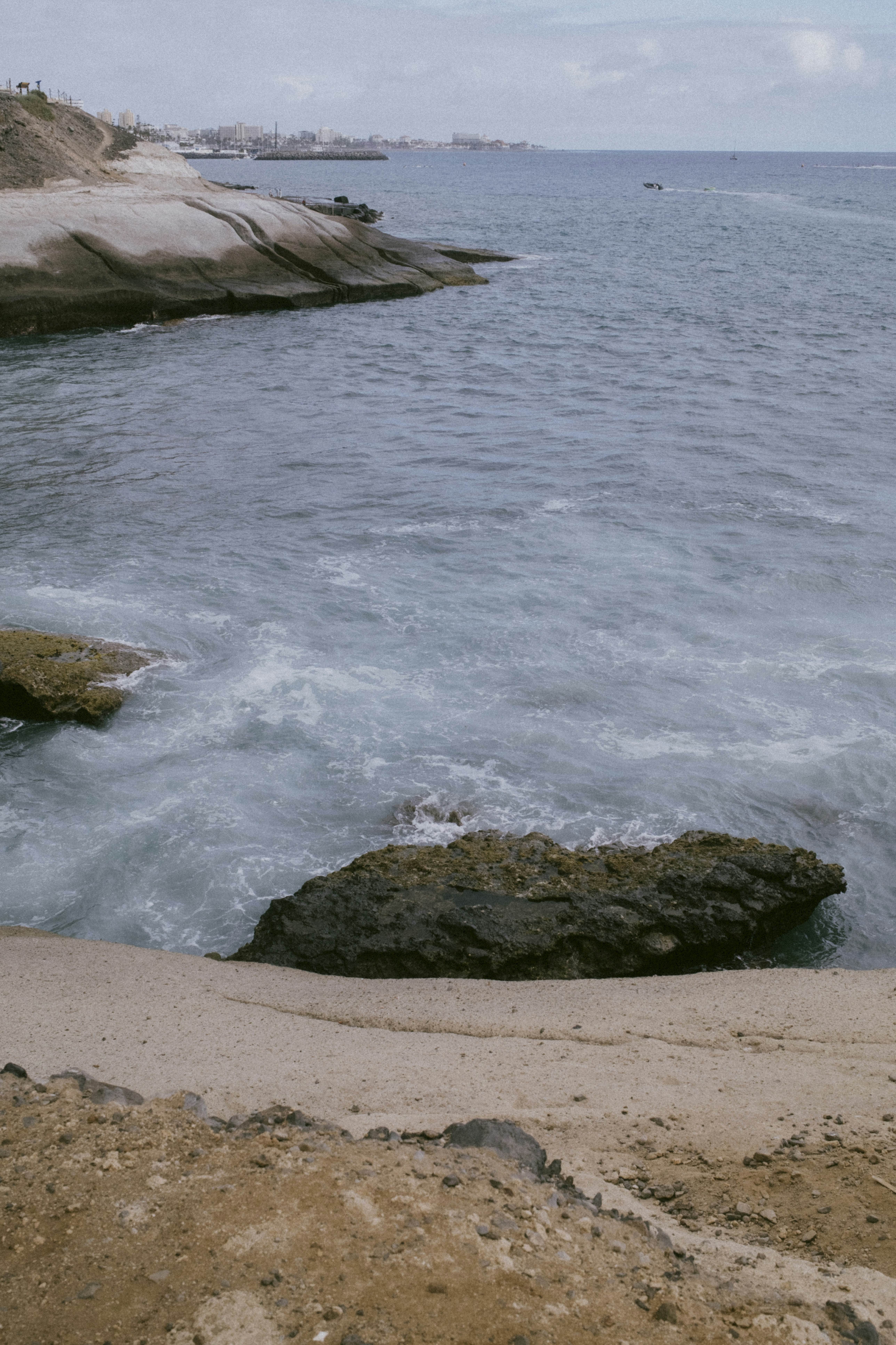Coastal Edge: A Quiet Confluence of Sand, Rock, and Sea
