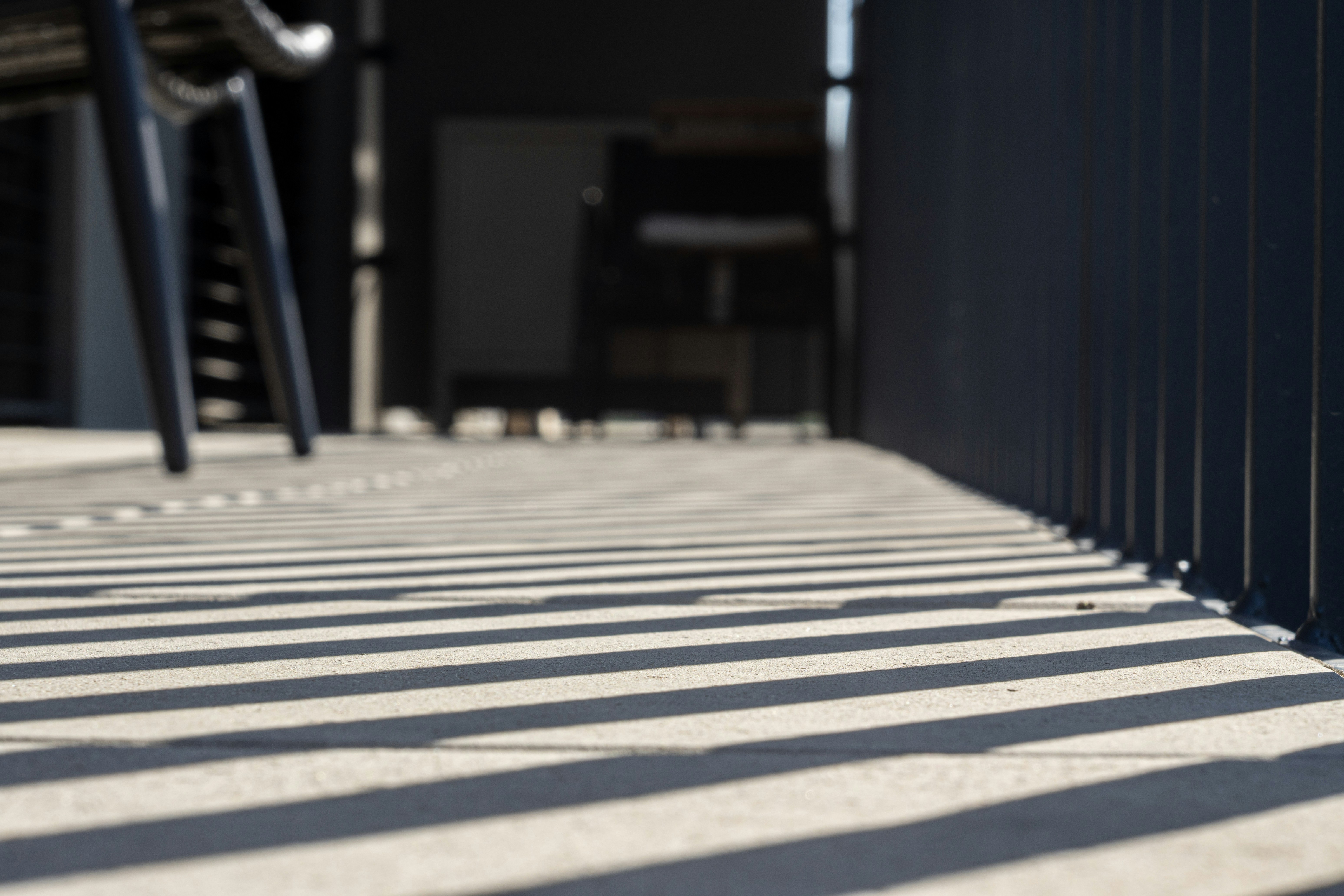 Shadows Across the Industrial Walkway