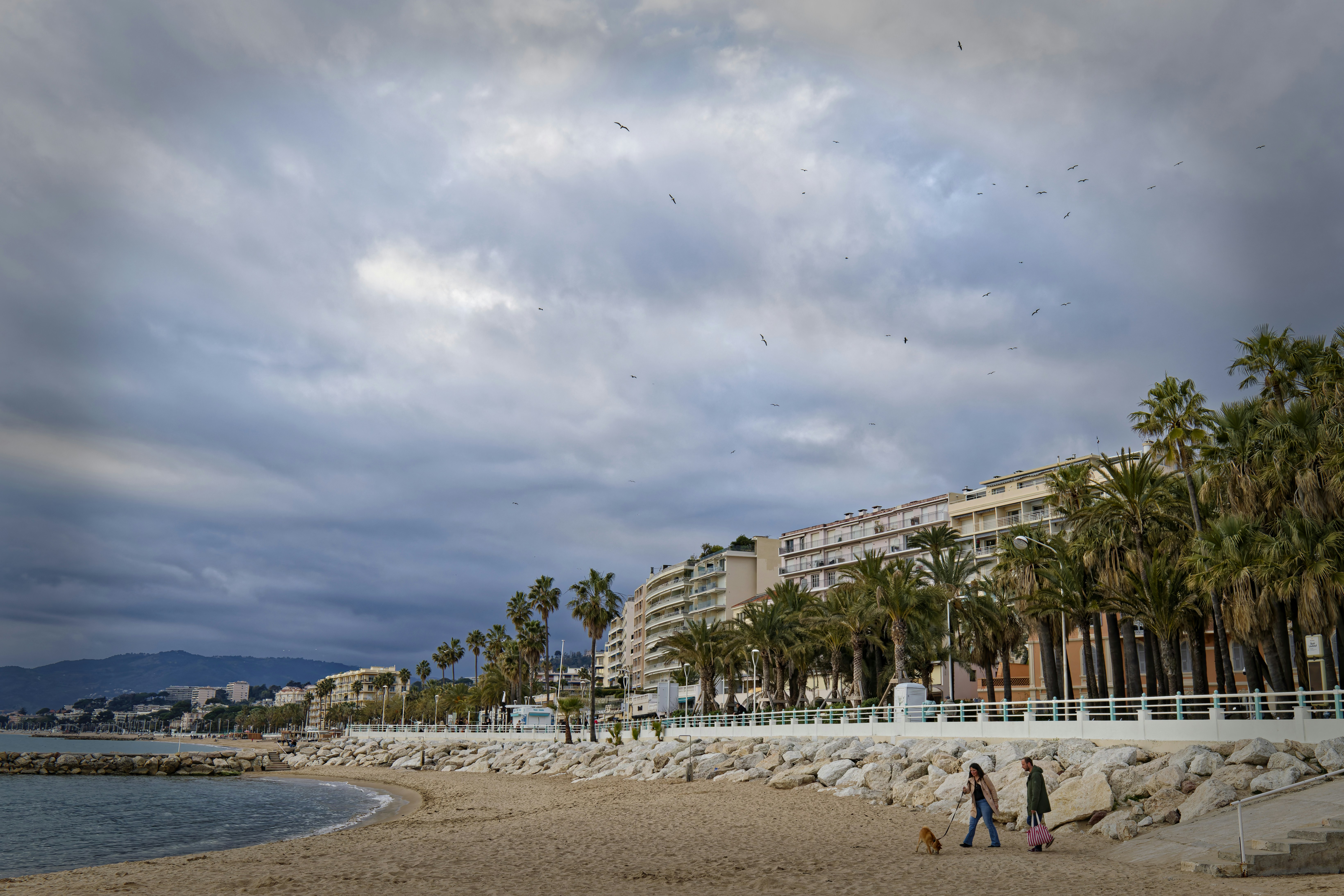 Seaside Promenade Under Tumultuous Skies