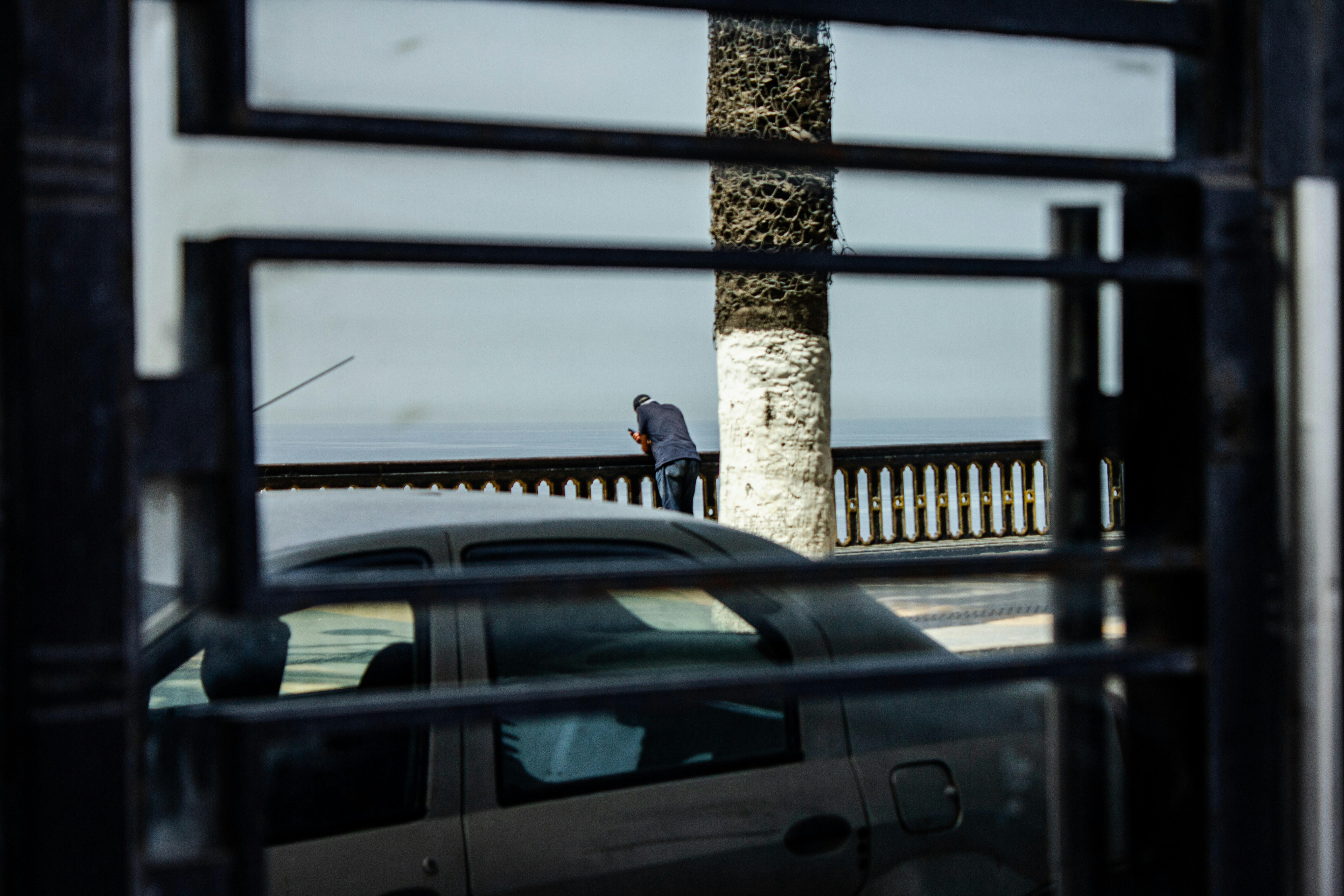 Strait on the Pier: A Figure by the White-Washed Column