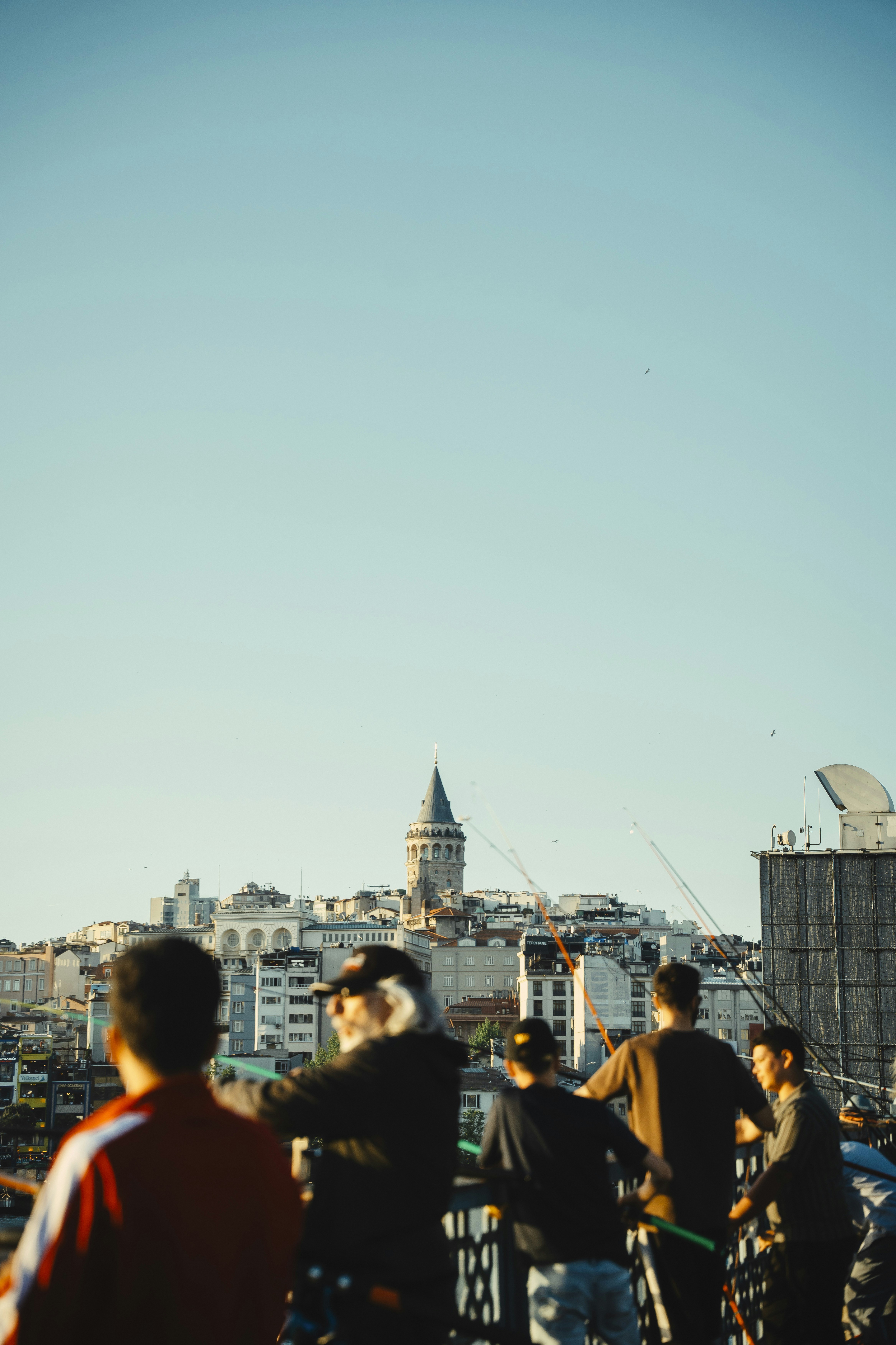 Rooftop Gathering with a Clocktower Skyline