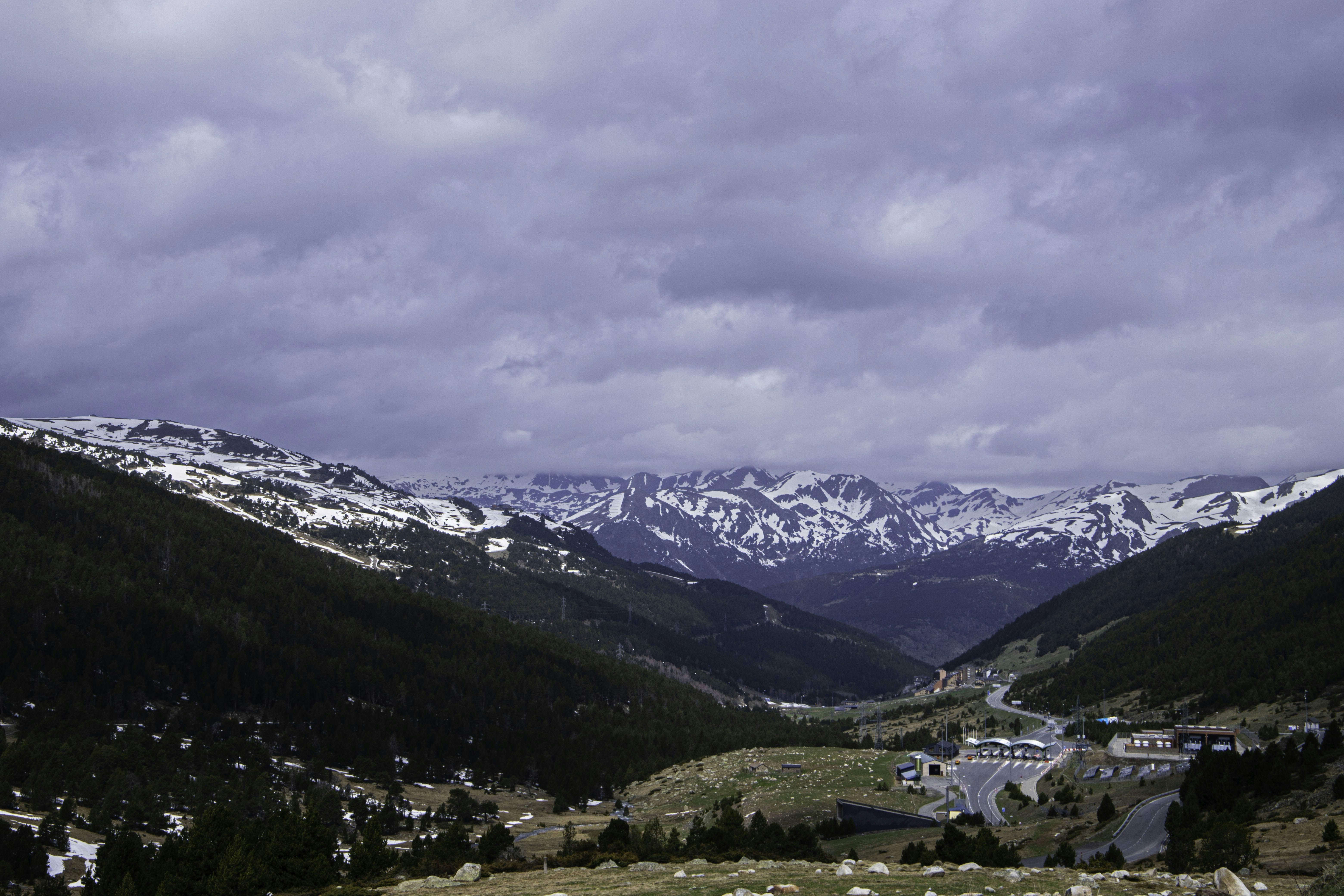 Snow-Capped Valleys Under a Misty Sky