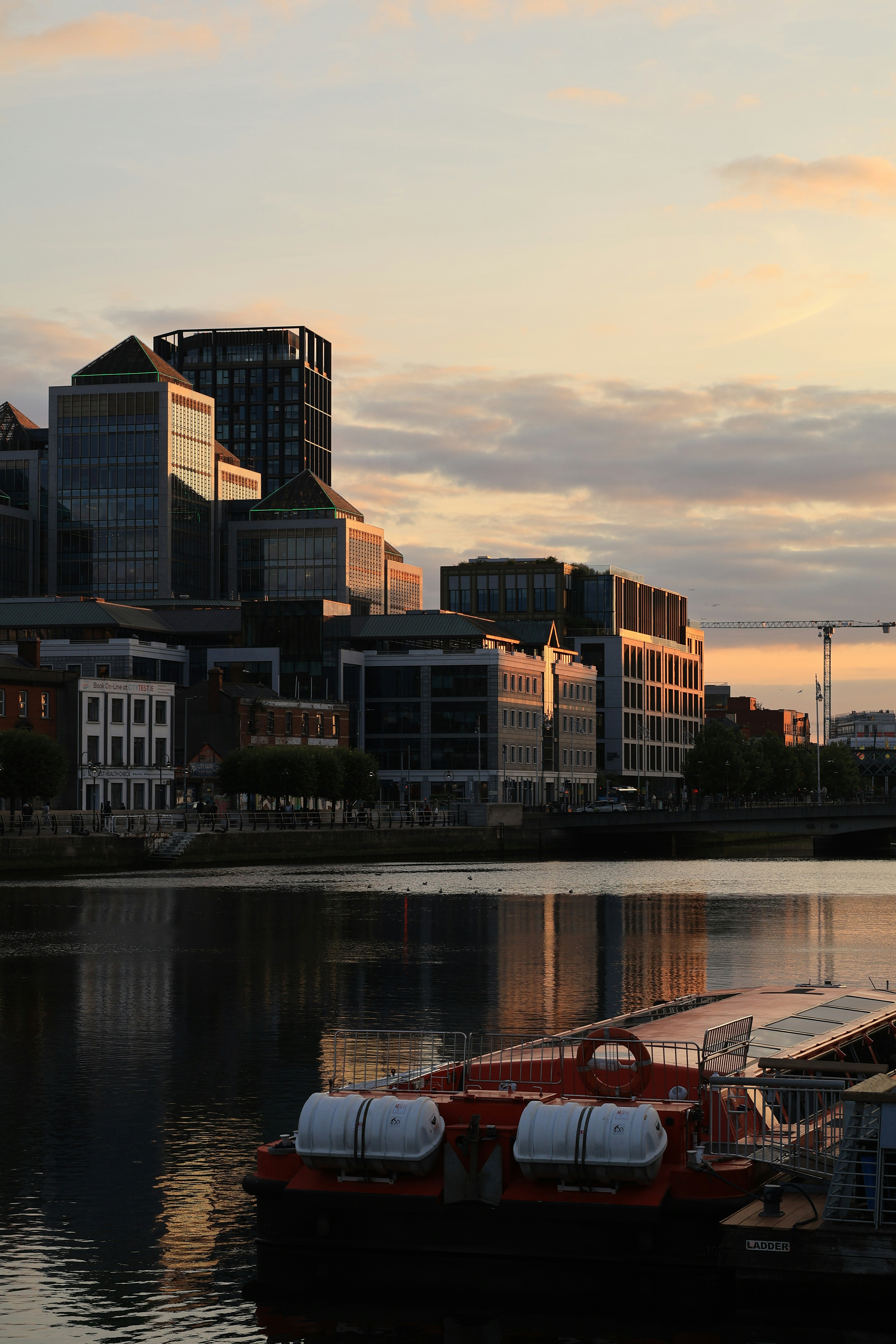 Harbor Skyline at Sunset: Glass and River Light