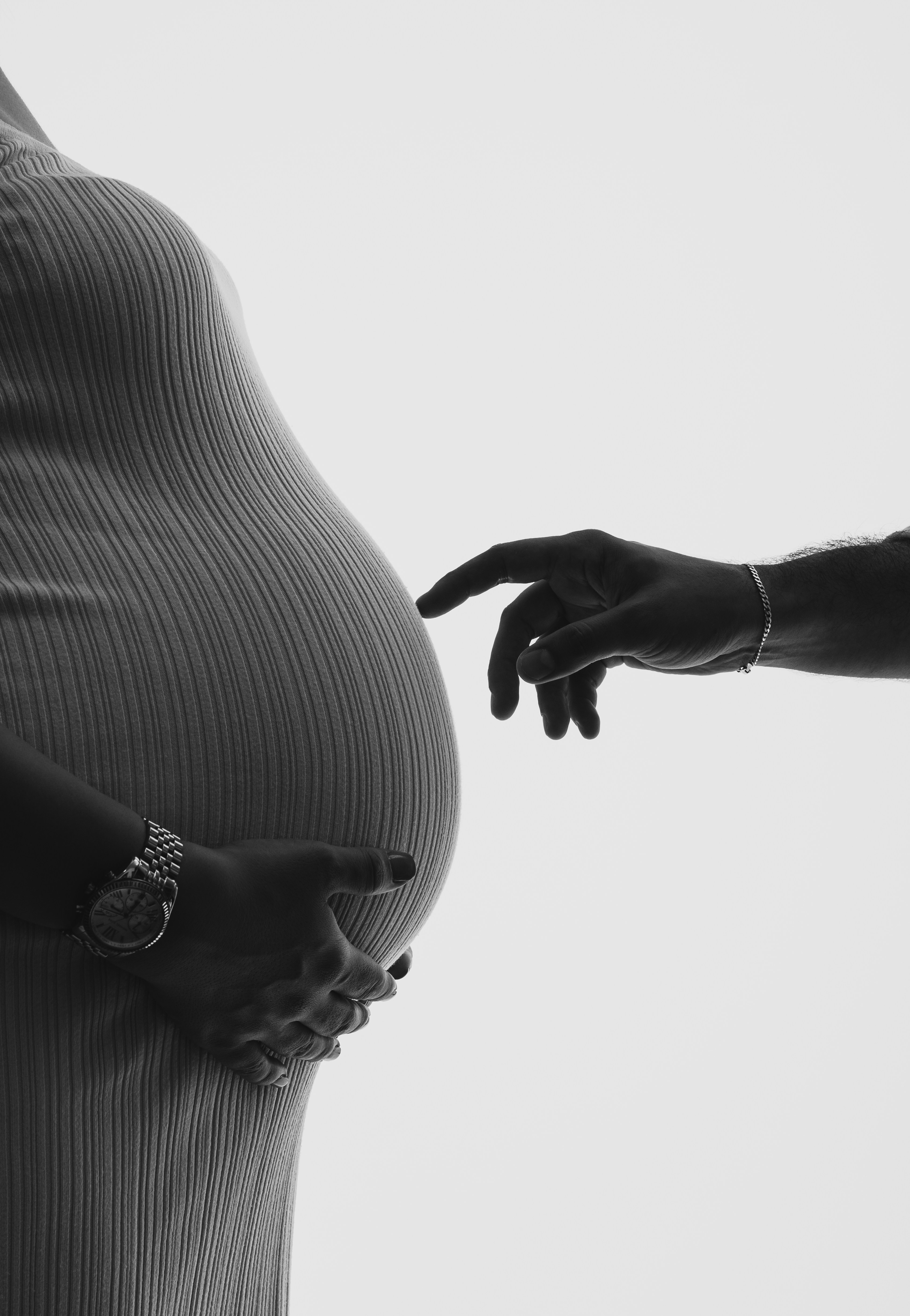 Maternity Silhouette: The Gentle Moment of Touch