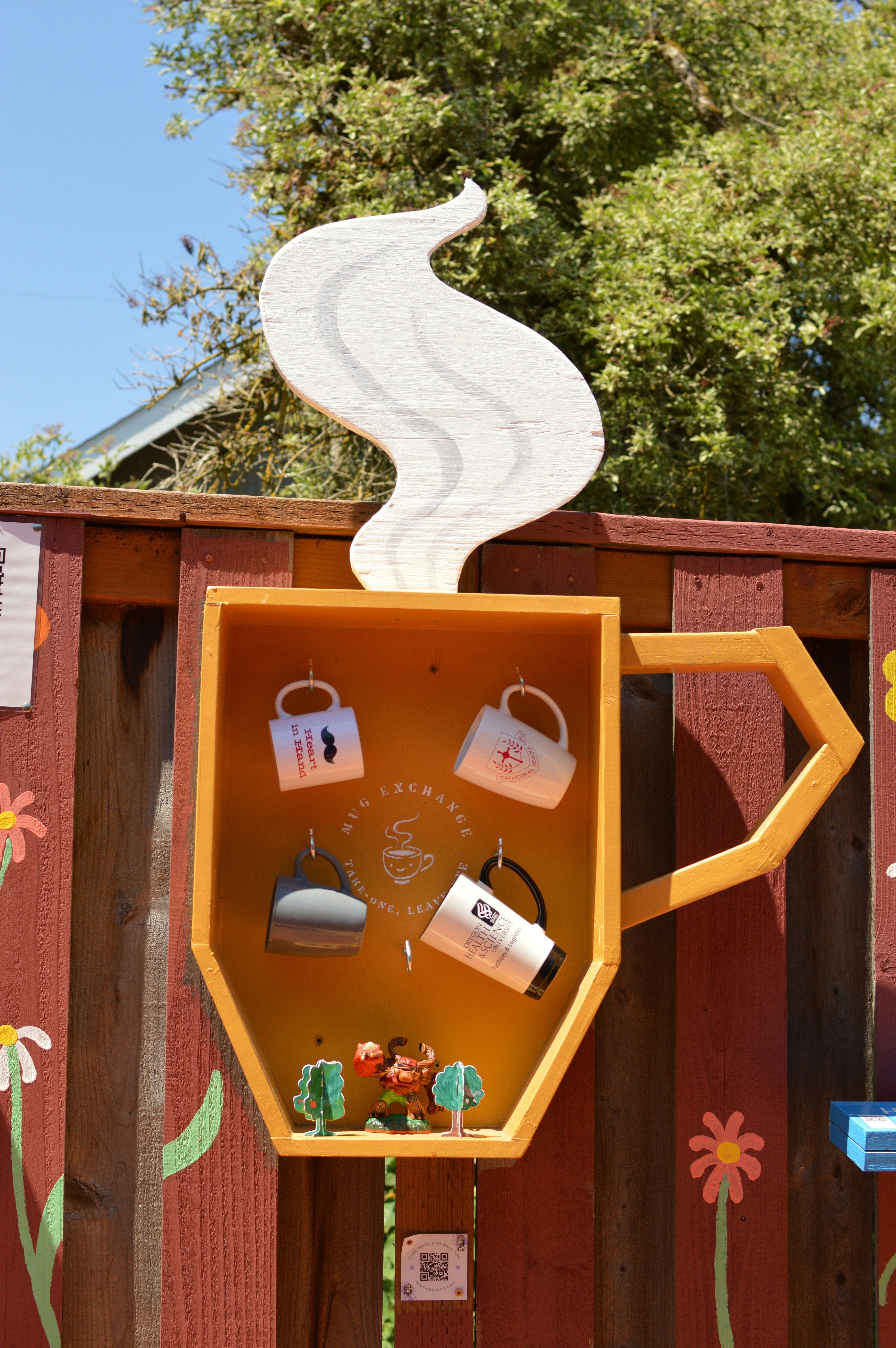 Steam-spiral Tea Cup Ornament in a Painted Fence Garden